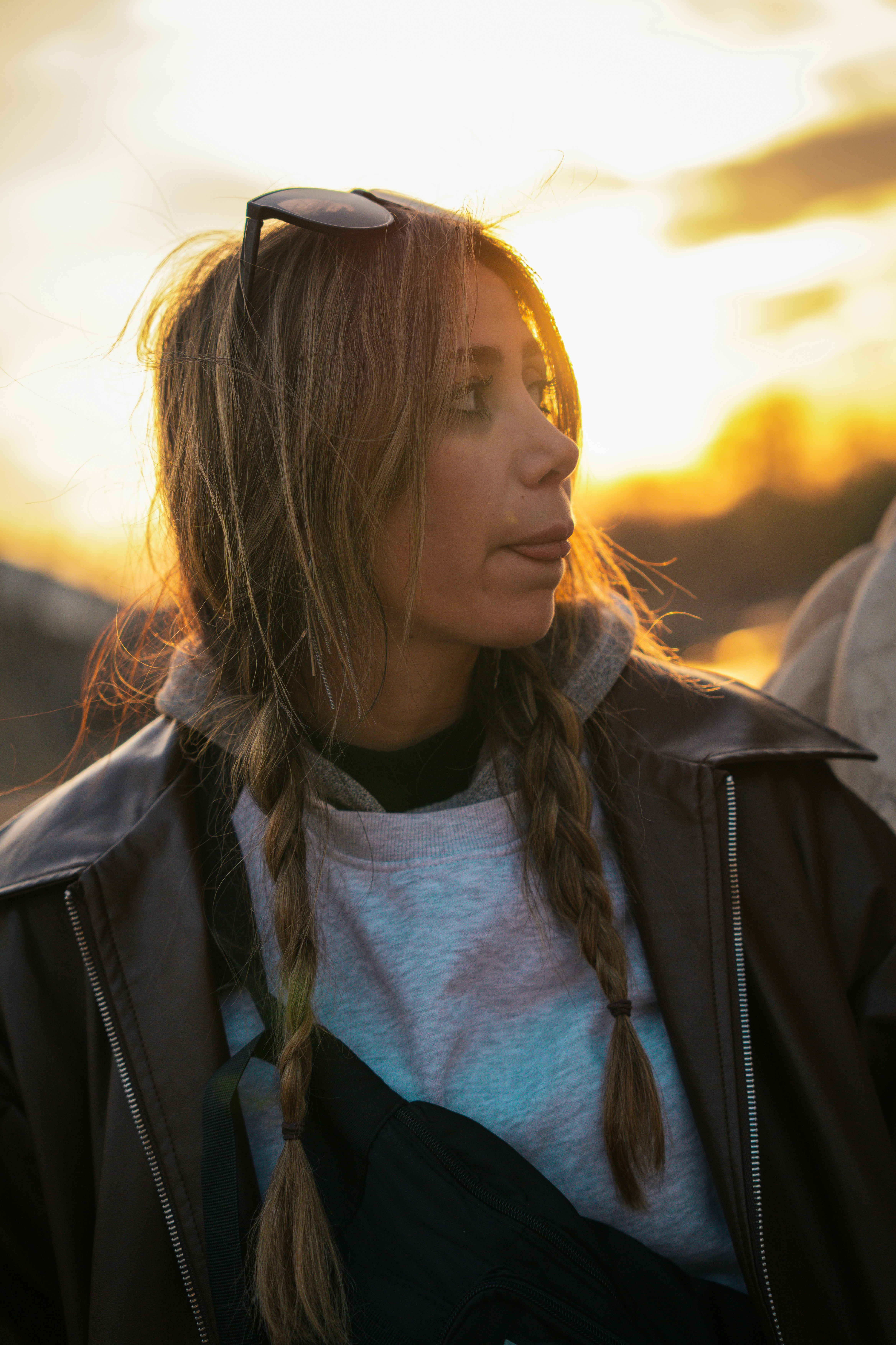 Amber Hour Portrait: Braids Under a Sunset