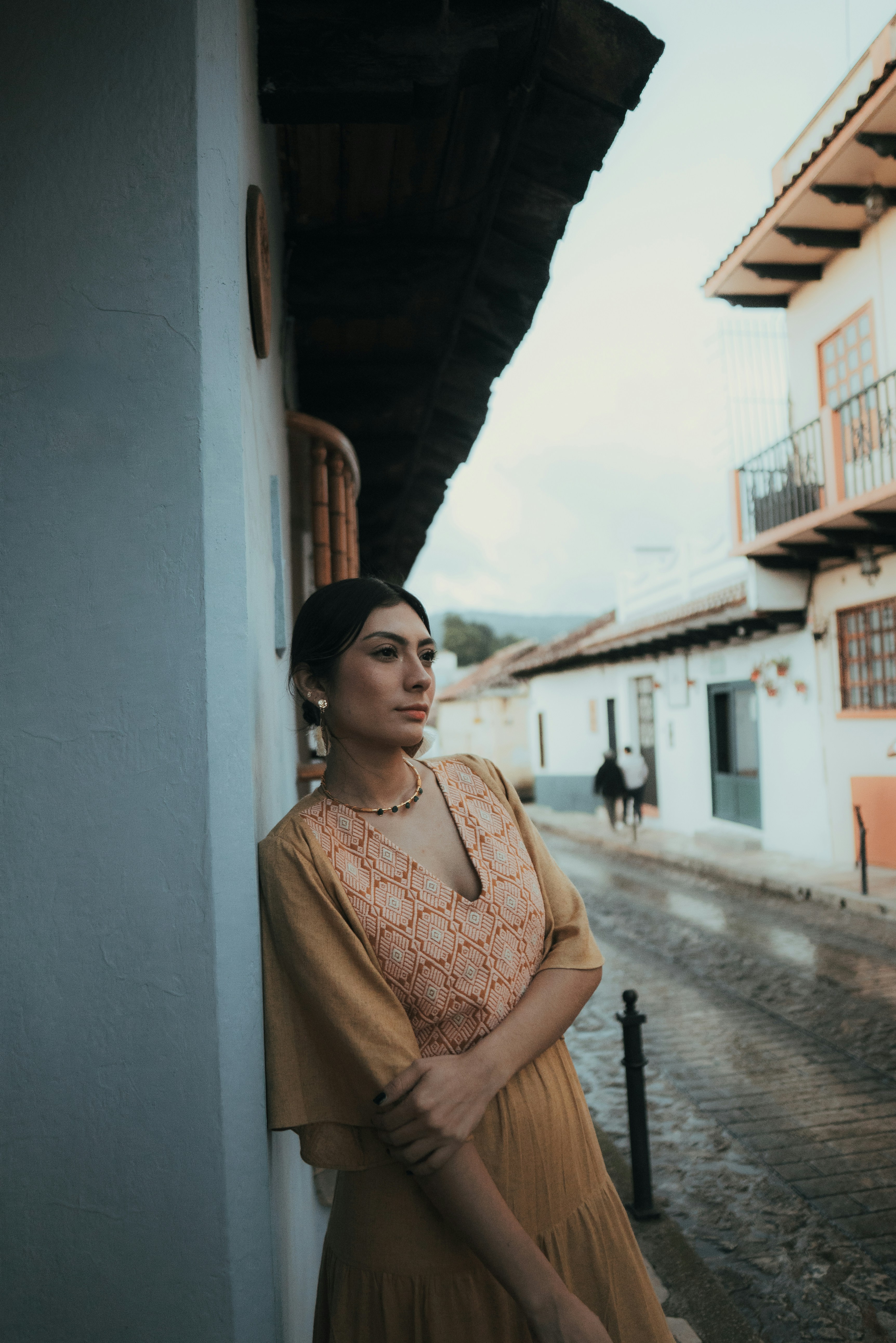Woman poses thoughtfully on a quaint, european street. photo – Free ...