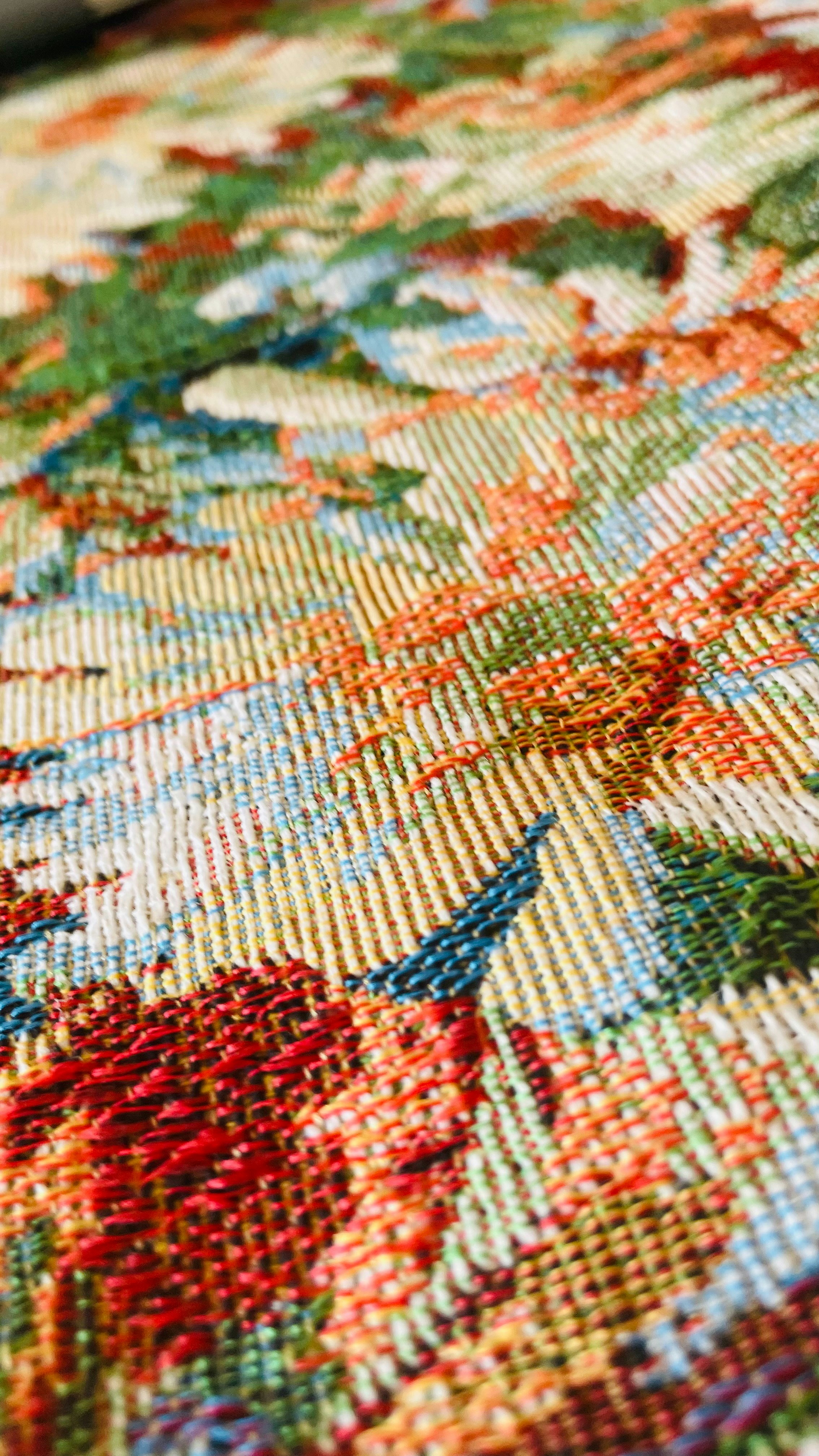 Woven Mosaic: Close-up of a Textured Tapestry with Multicolored Threads
