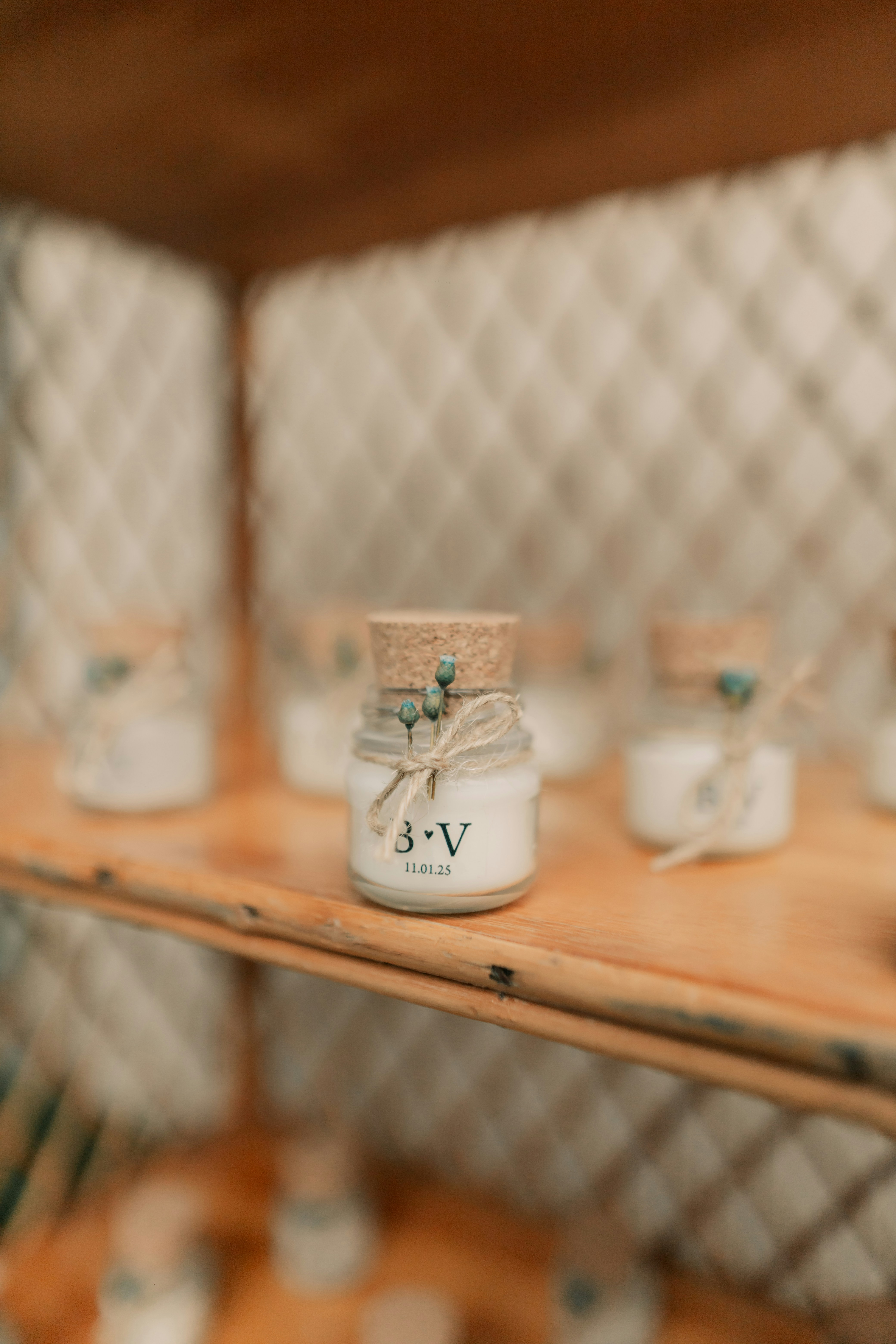 Miniature Vial Linens: A Row of Tiny Bottles on a Wooden Shelf