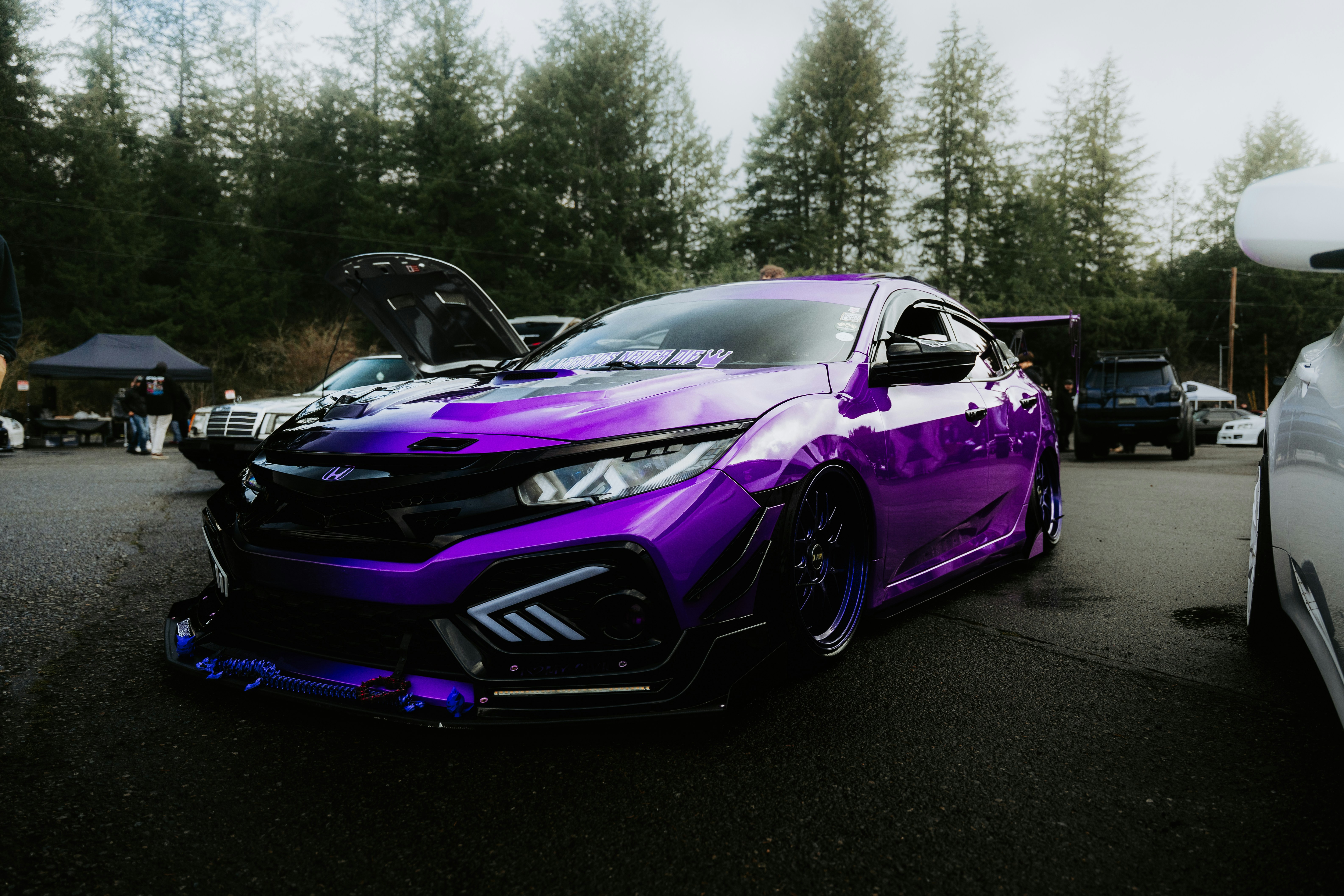 A purple modified car displays at a car show. photo – Free Car Image on ...
