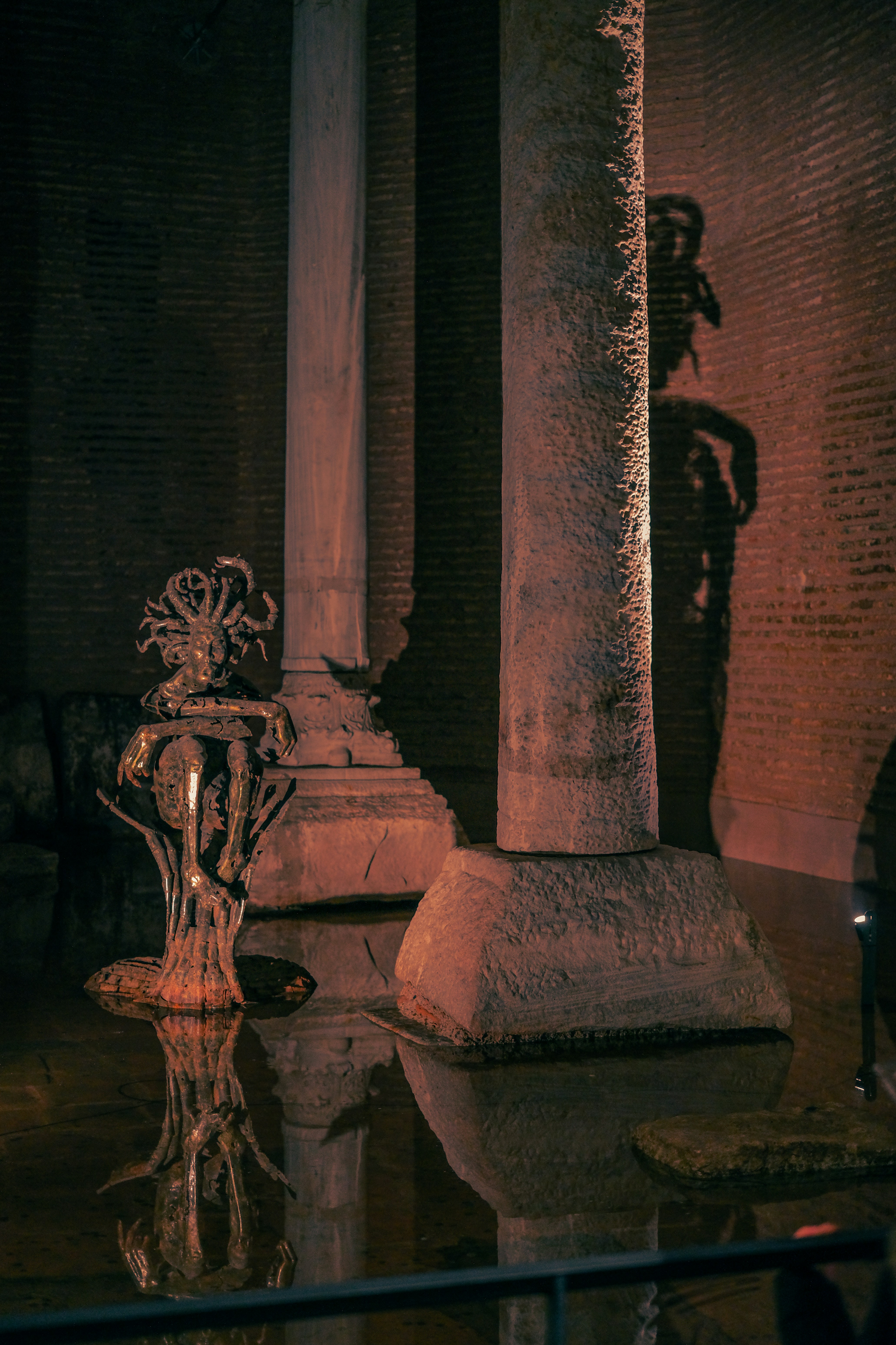 An ancient cistern reflects statues and pillars. photo – Free Wood ...