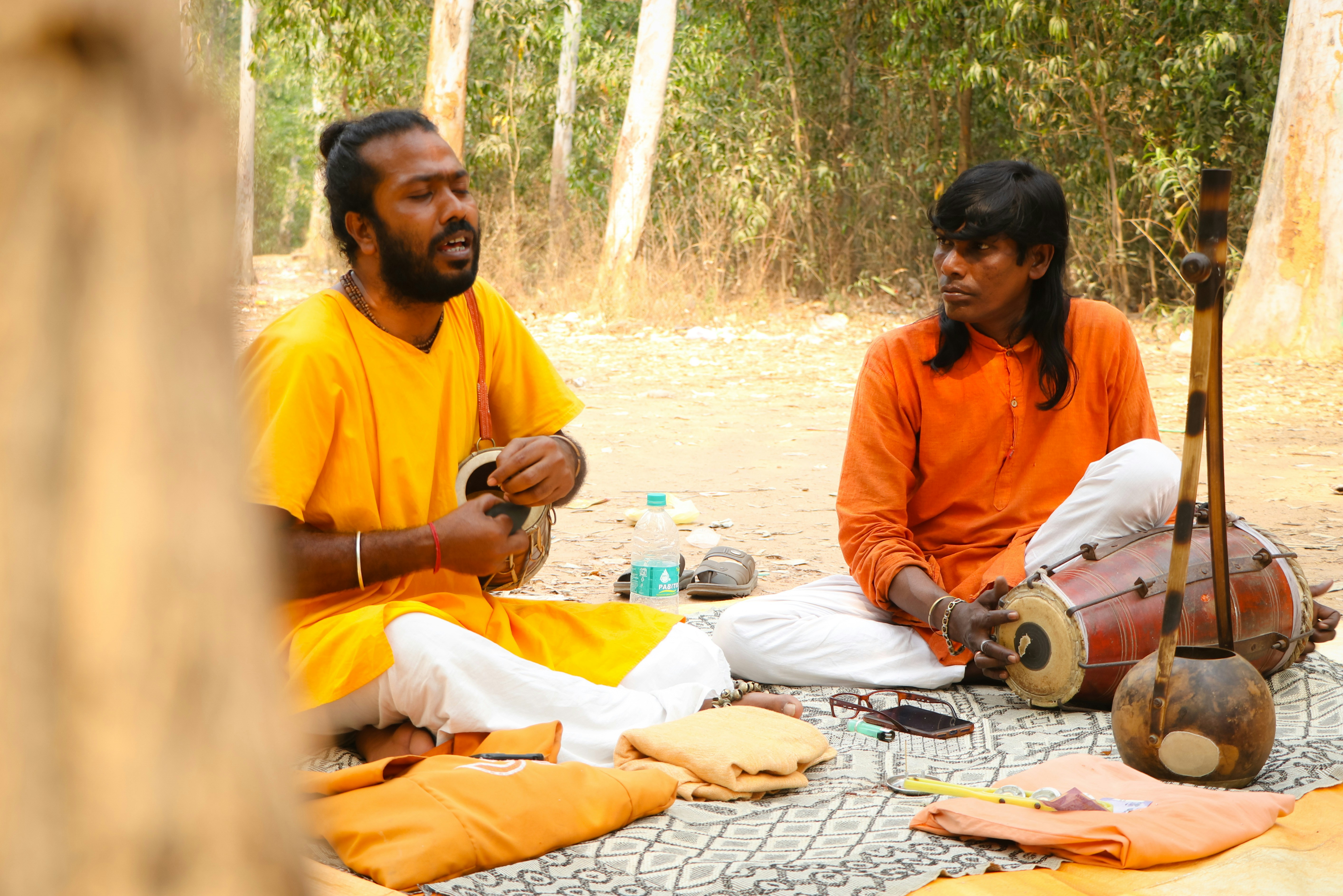 Two musicians play instruments outdoors. photo – Free Human Image on ...