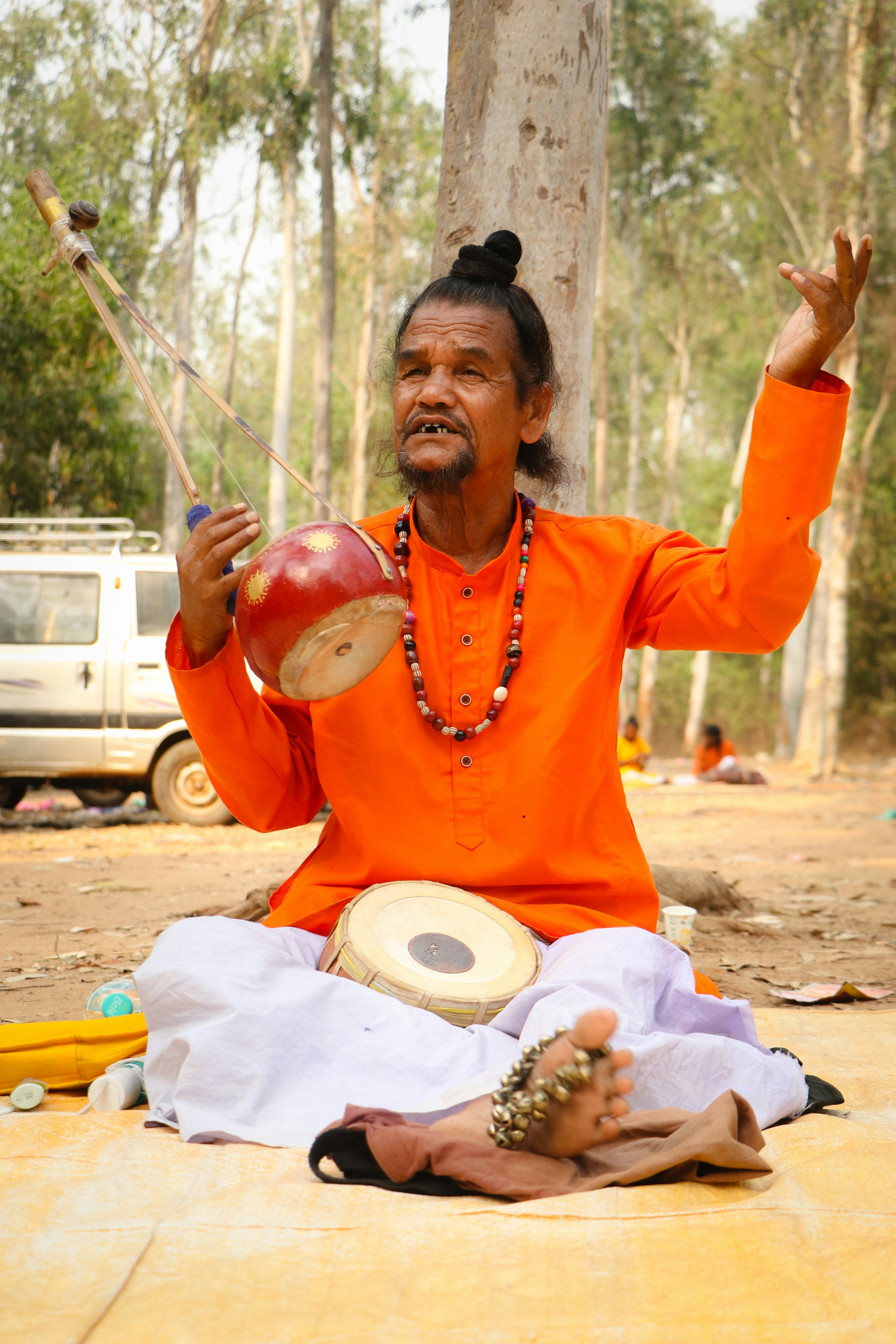 A man plays an instrument outside in nature. photo – Free Human Image ...