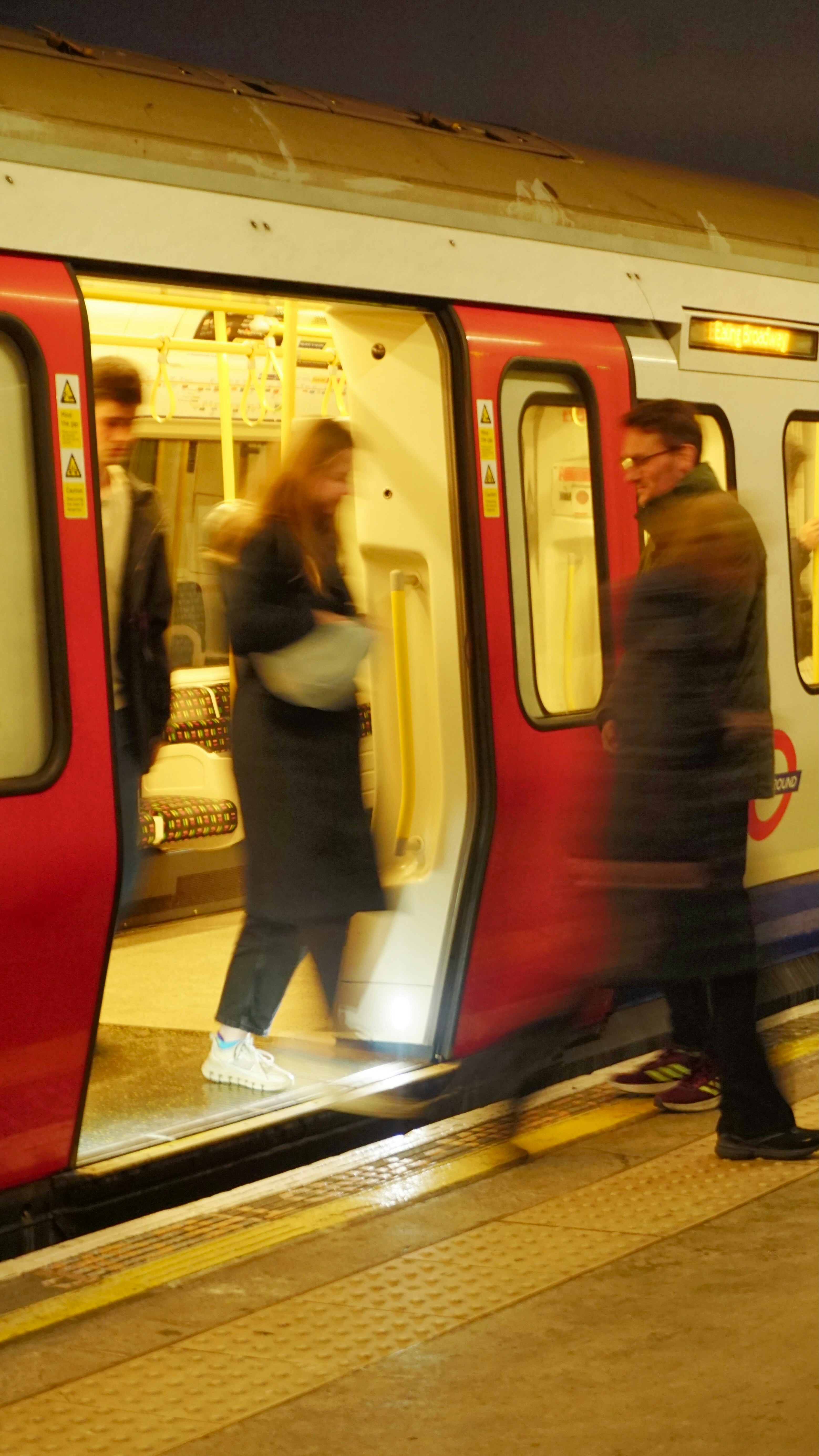 People are getting off of a train at a station. photo – Free Woman ...
