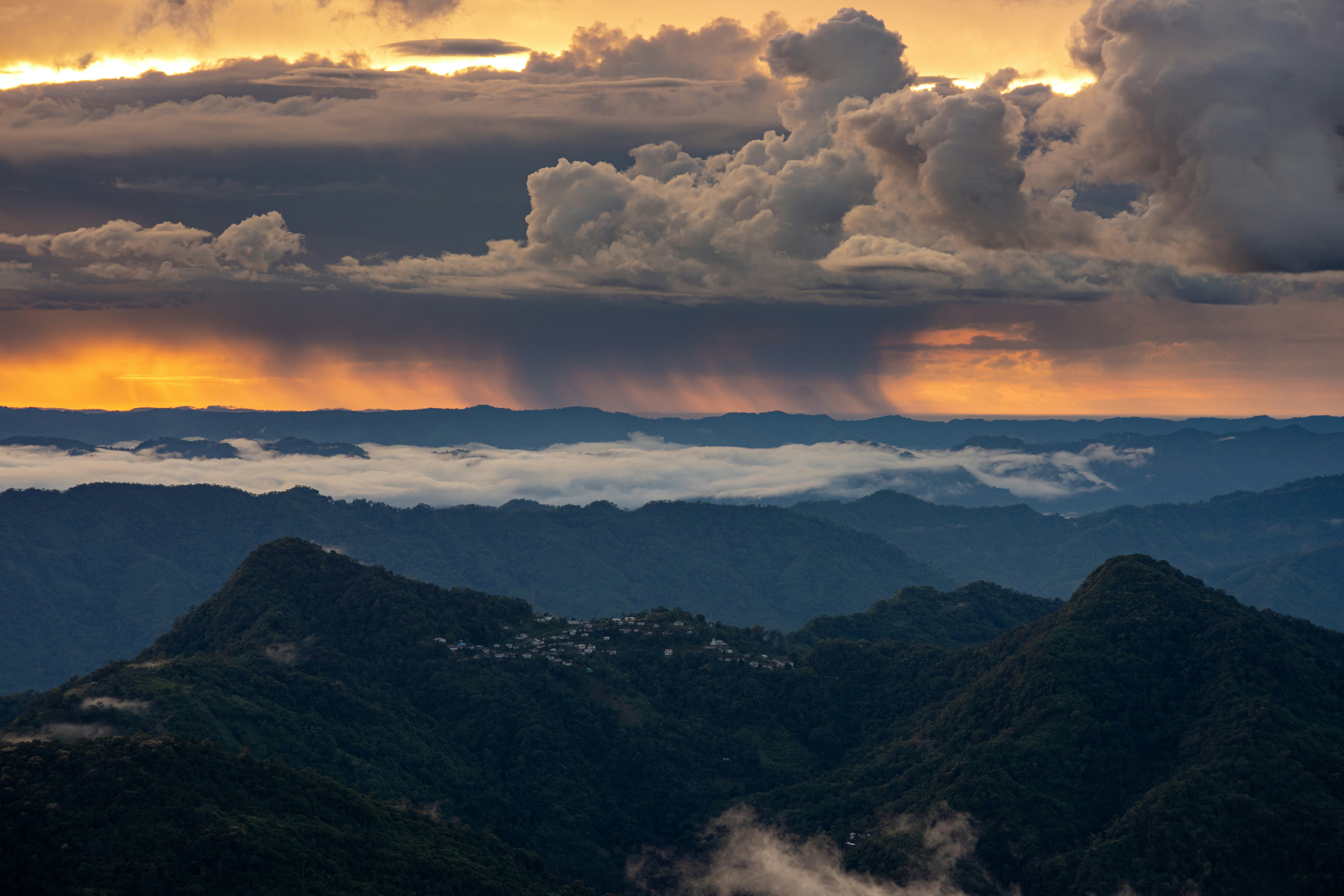 Rain showers fall over mountain range at sunset. photo – Free Forest ...