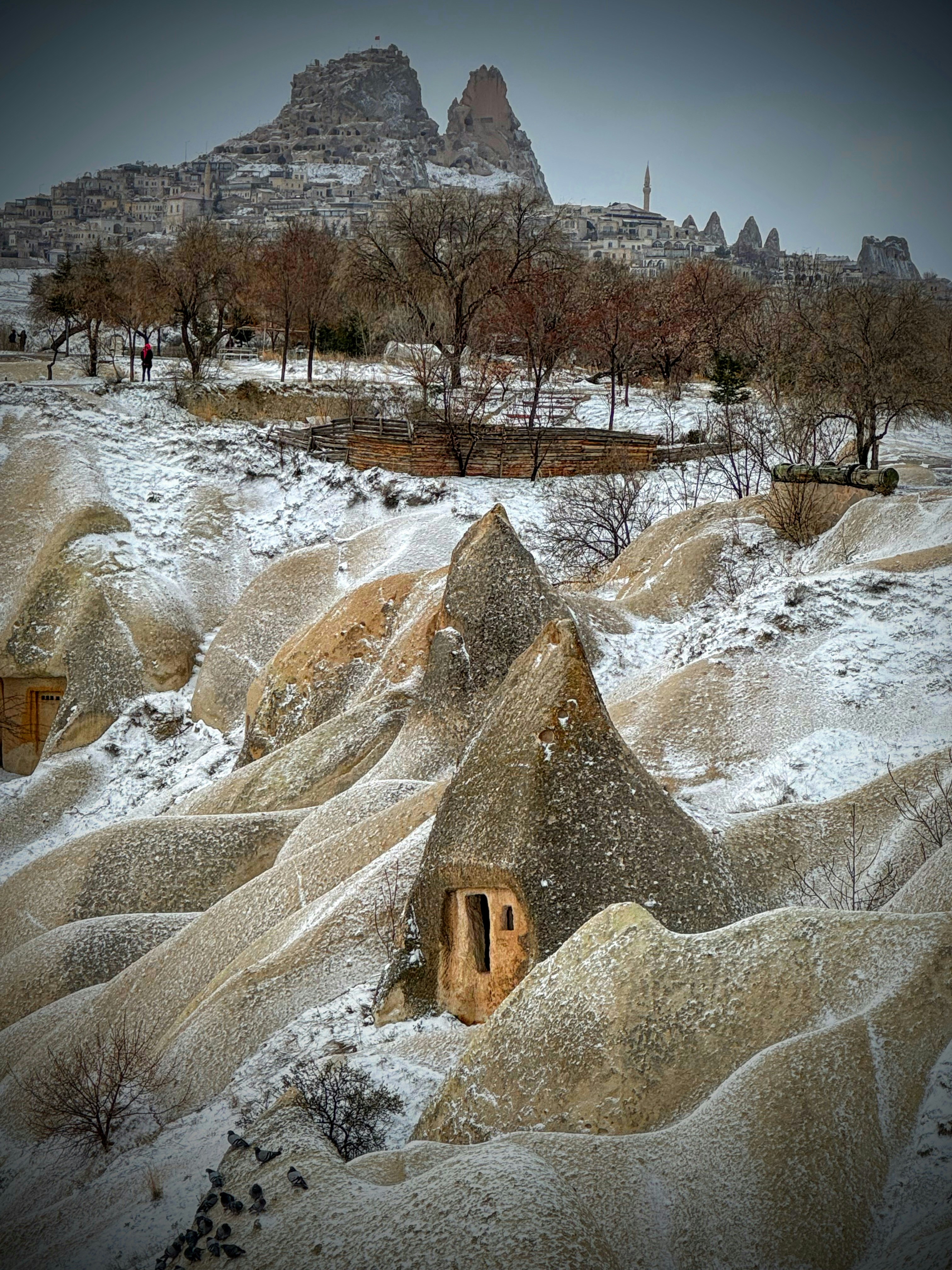 Snow-Kissed Cappadocia: A carved dwelling tucked among fairy chimneys in winter