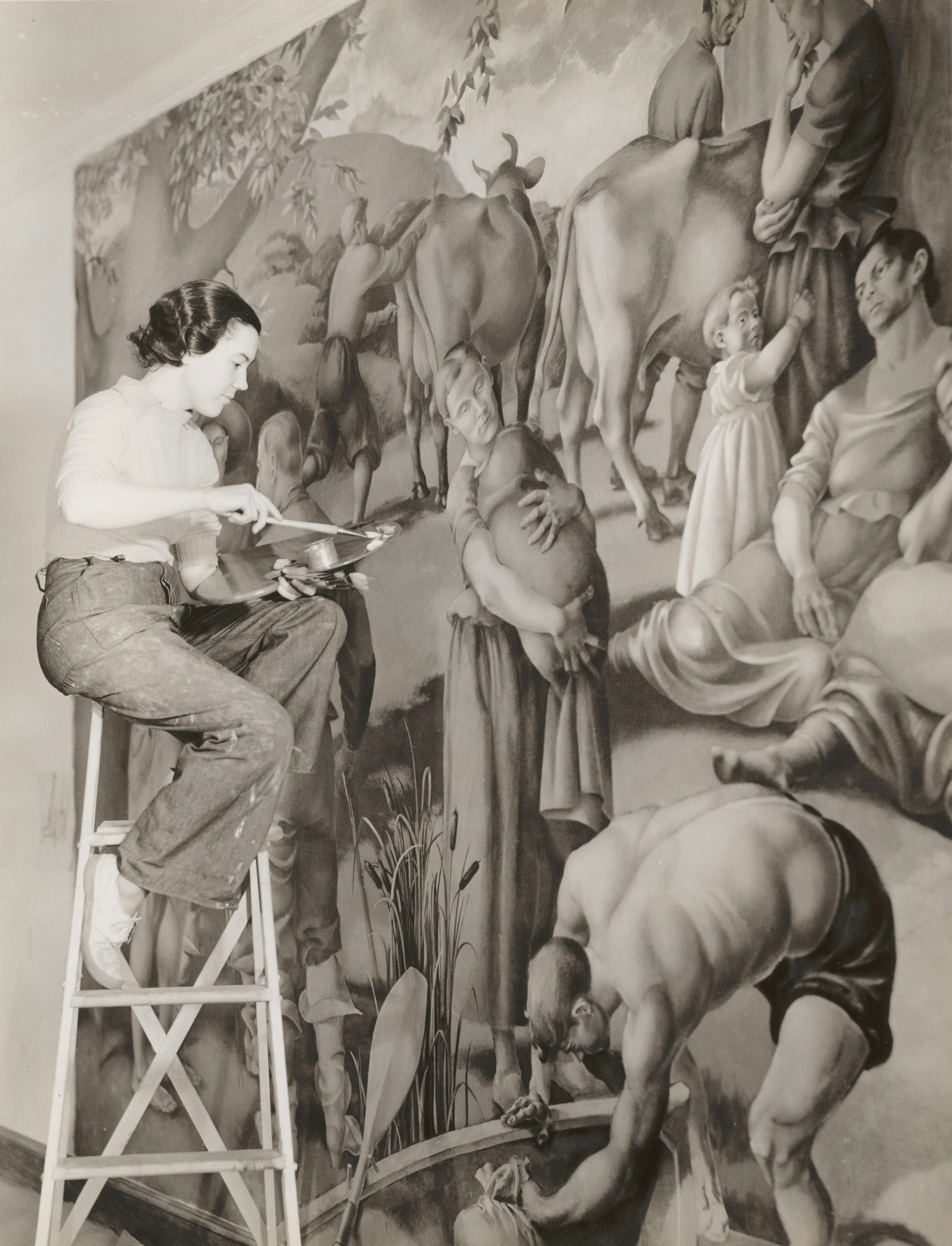 Woman paints a large mural with other figures. photo – Free Painting ...
