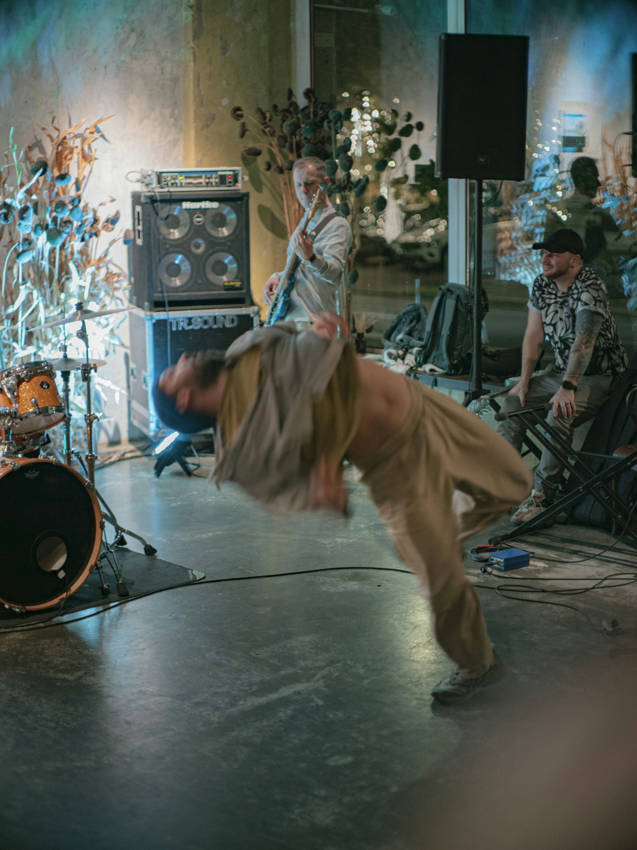 A musician performs a backbend during a concert.