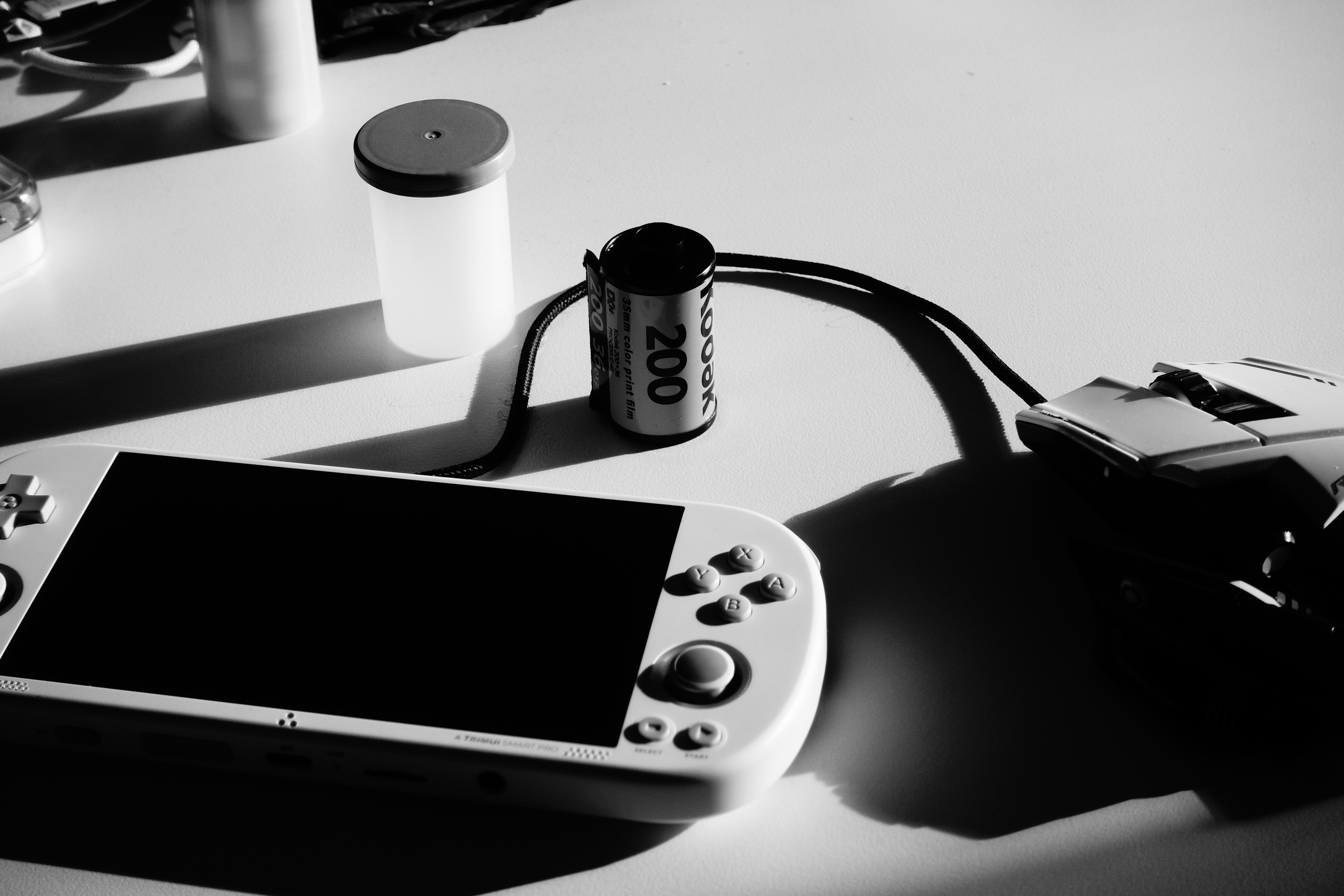A game console, film roll, and mouse are shown. photo – Free Car Image ...
