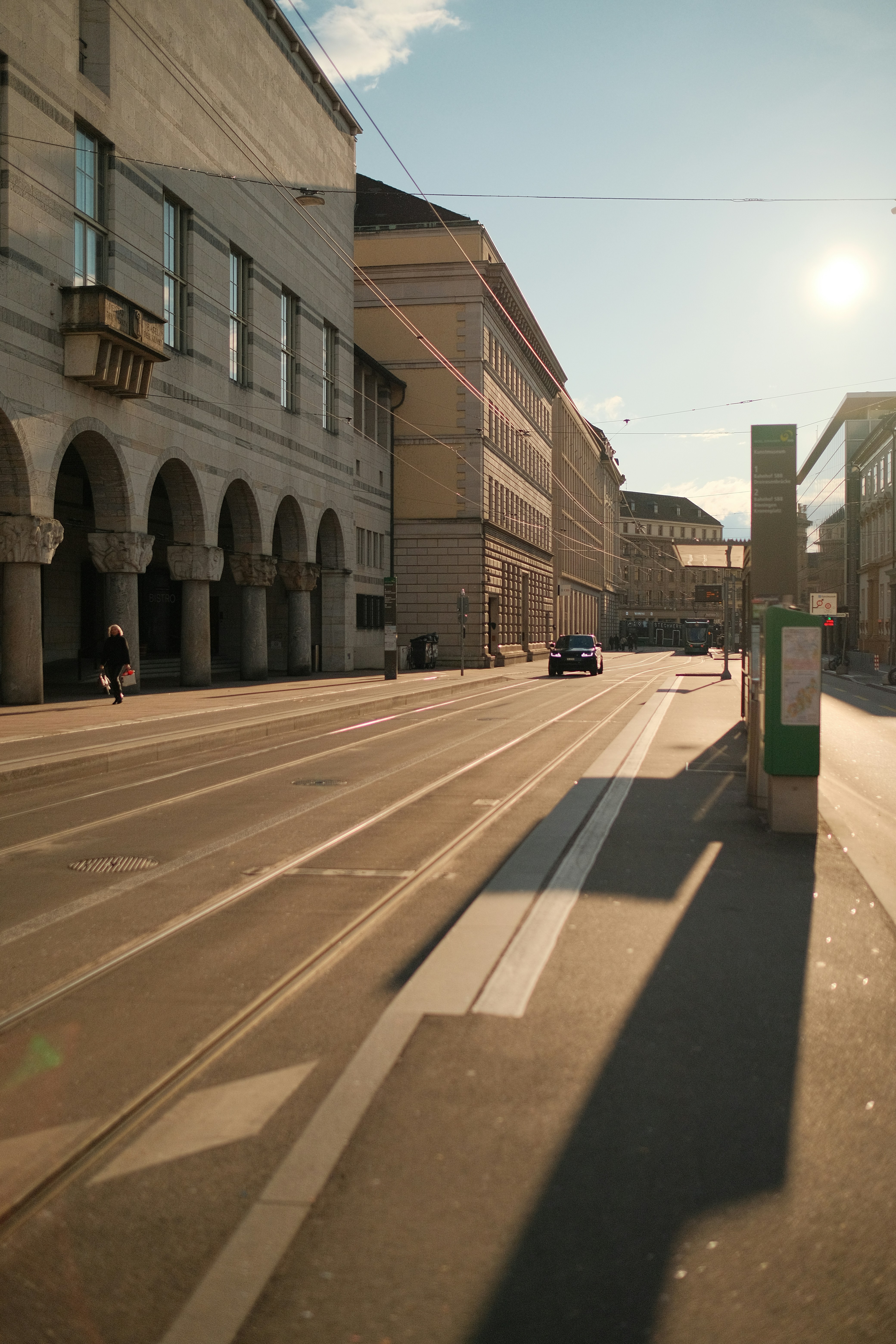 Dusk on Arcaded Boulevard: Rails Toward a Vanishing Point