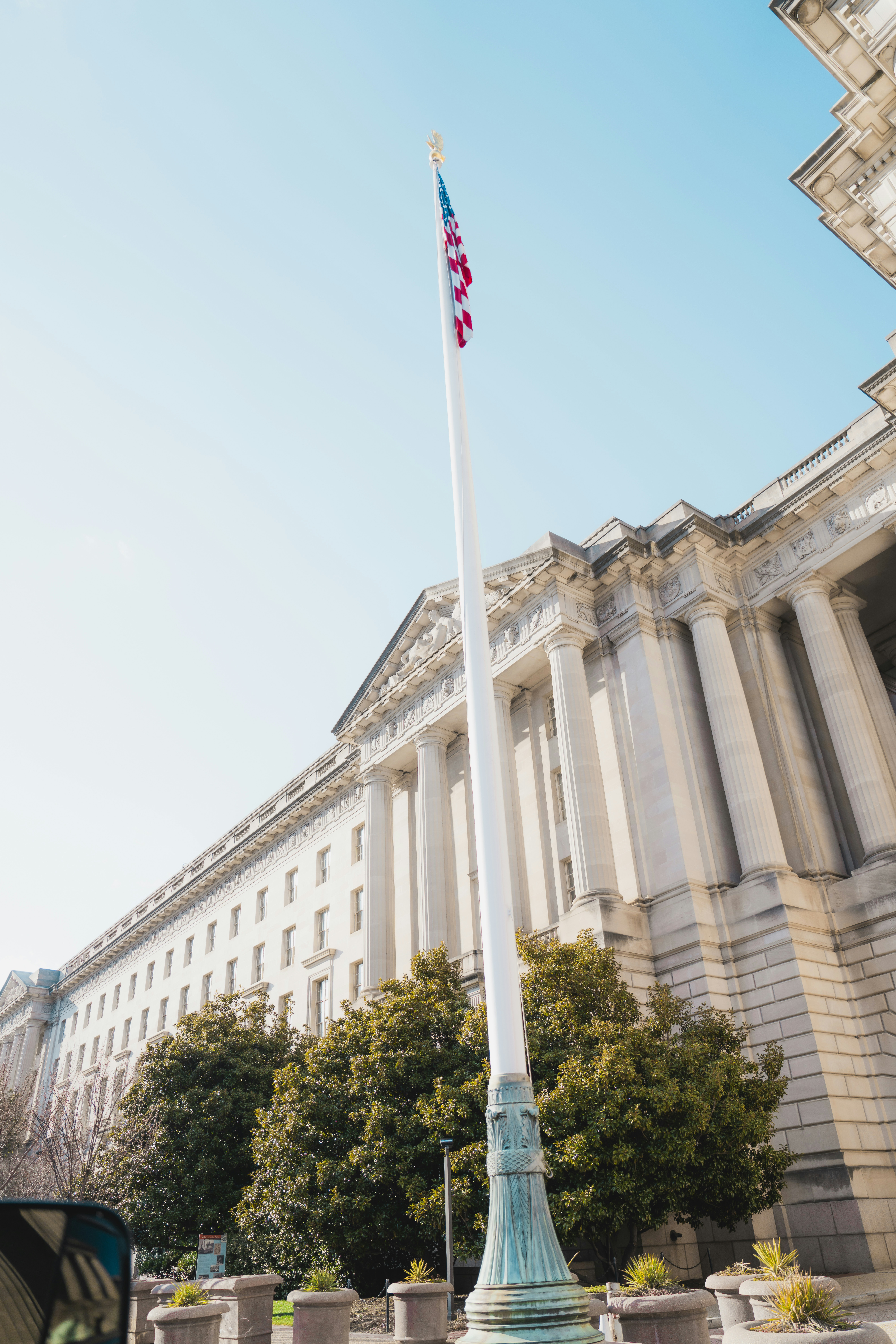 Flagpole in Front of Classical Facade: A Monumental Moment
