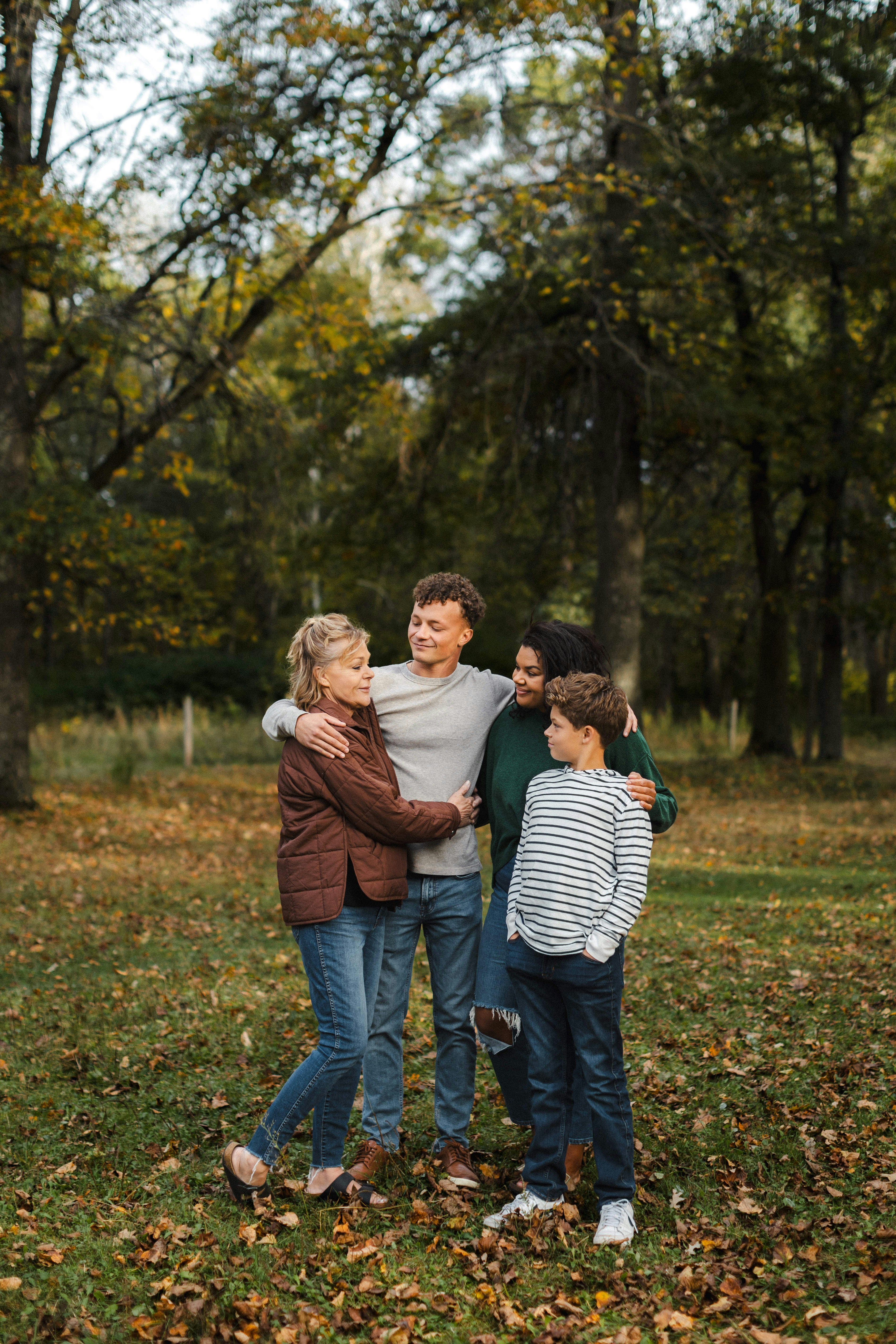Family poses together, embracing each other.Jennifer Kalenberg