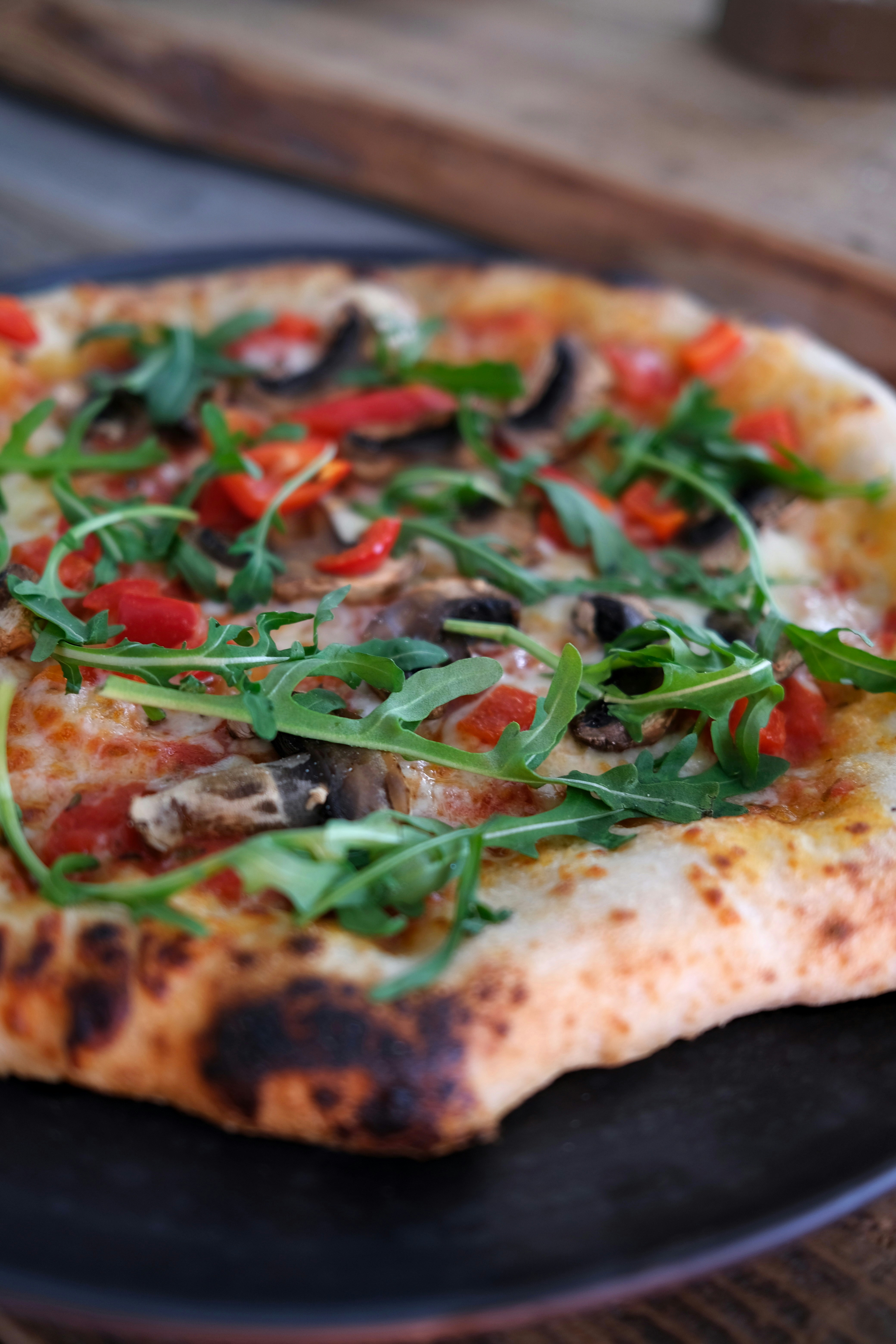 Fresh pizza with arugula and other toppings. photo – Free Food Image on ...