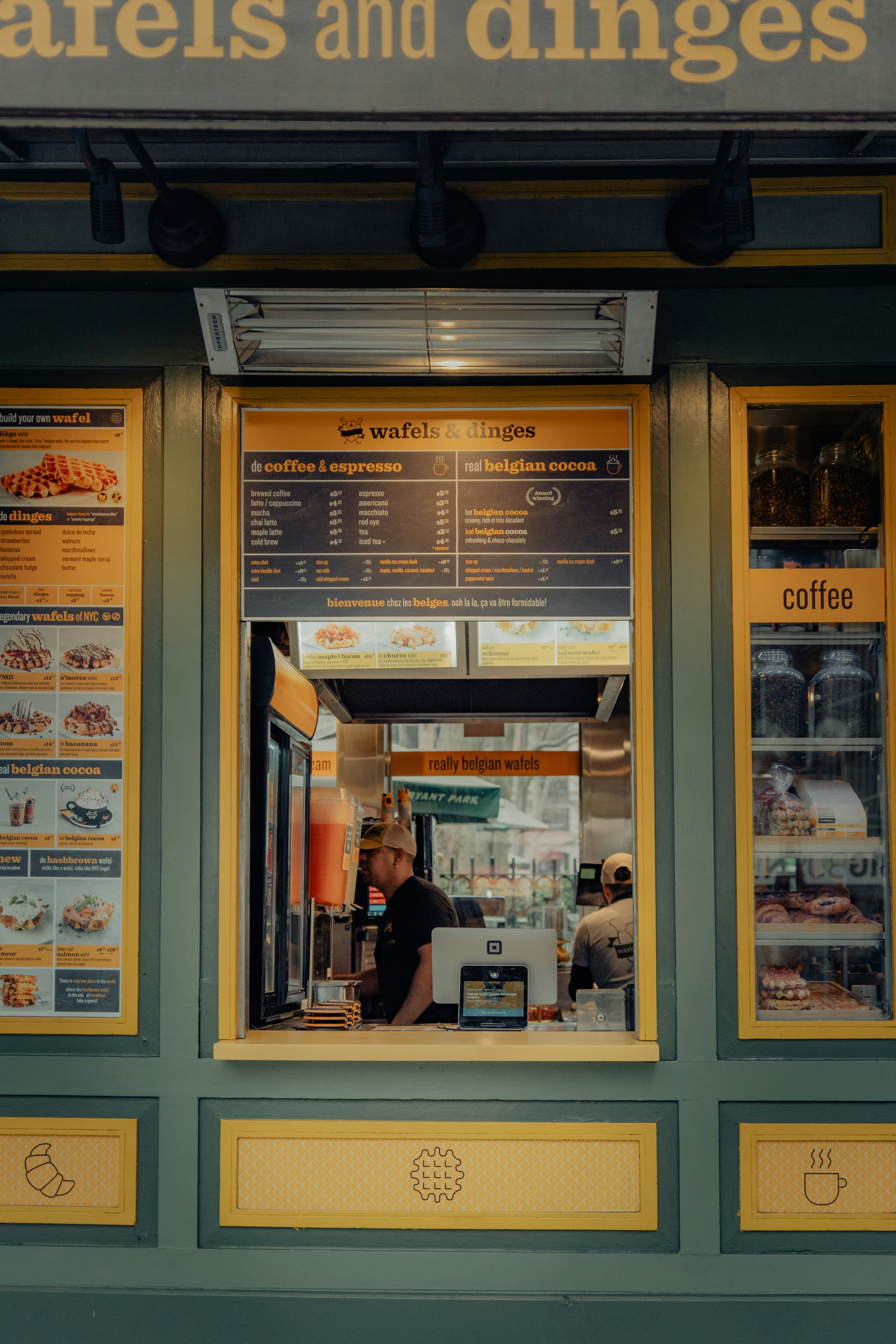 A waffles and dinges food stand is ready for service. photo – Free ...