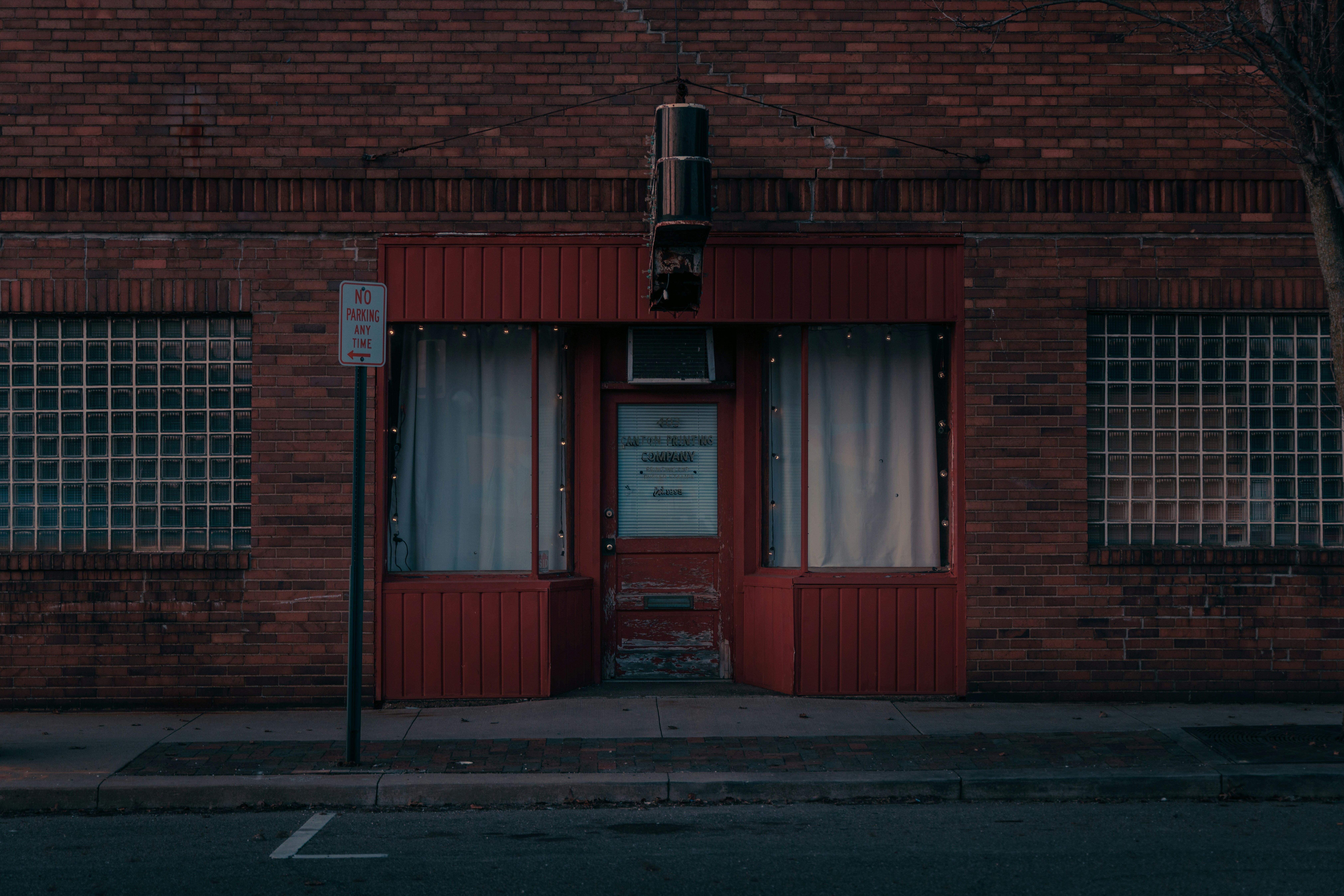 Red brick building with a business storefront. photo – Free City Image ...