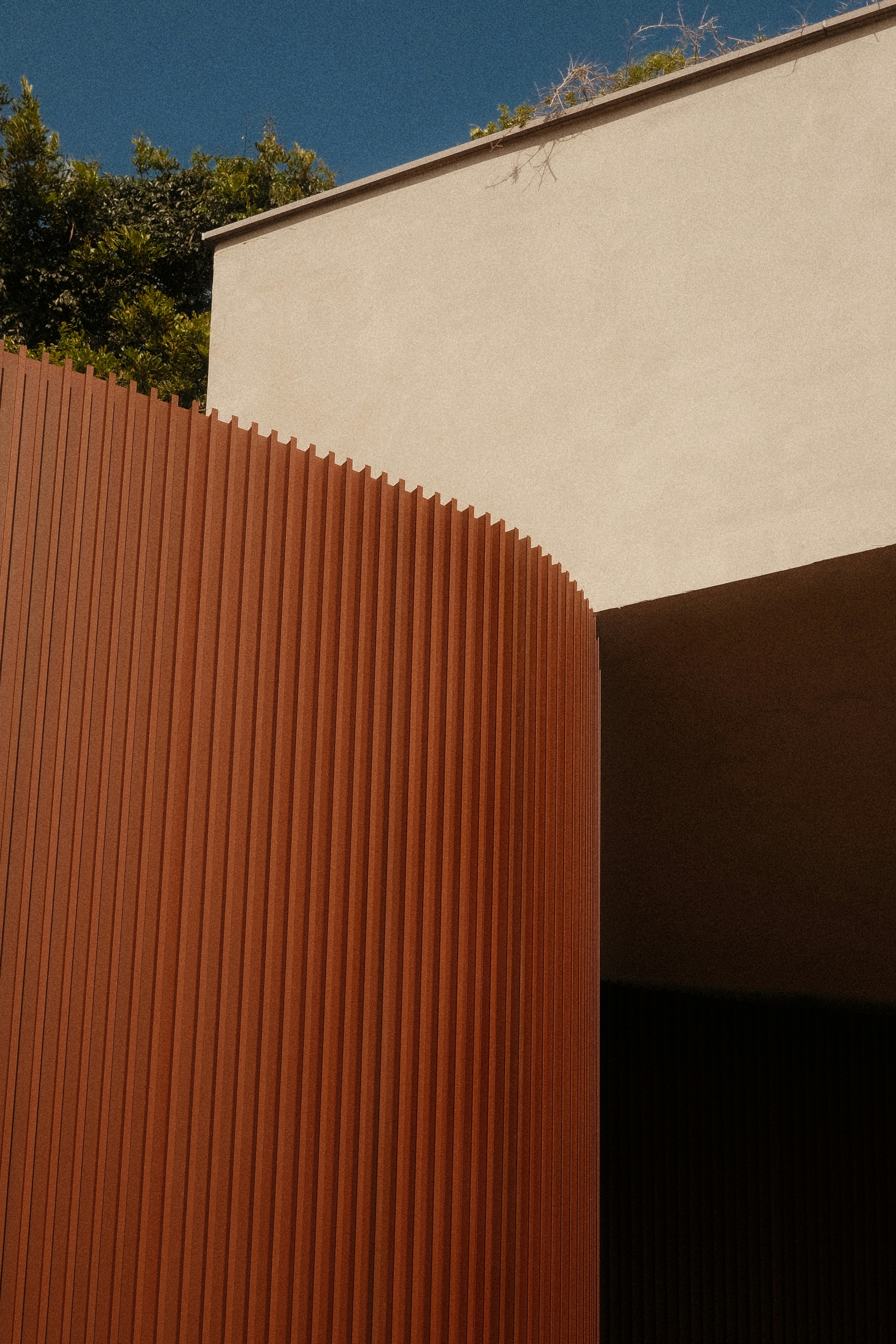 A modern building with a unique architectural design. photo – Free ...