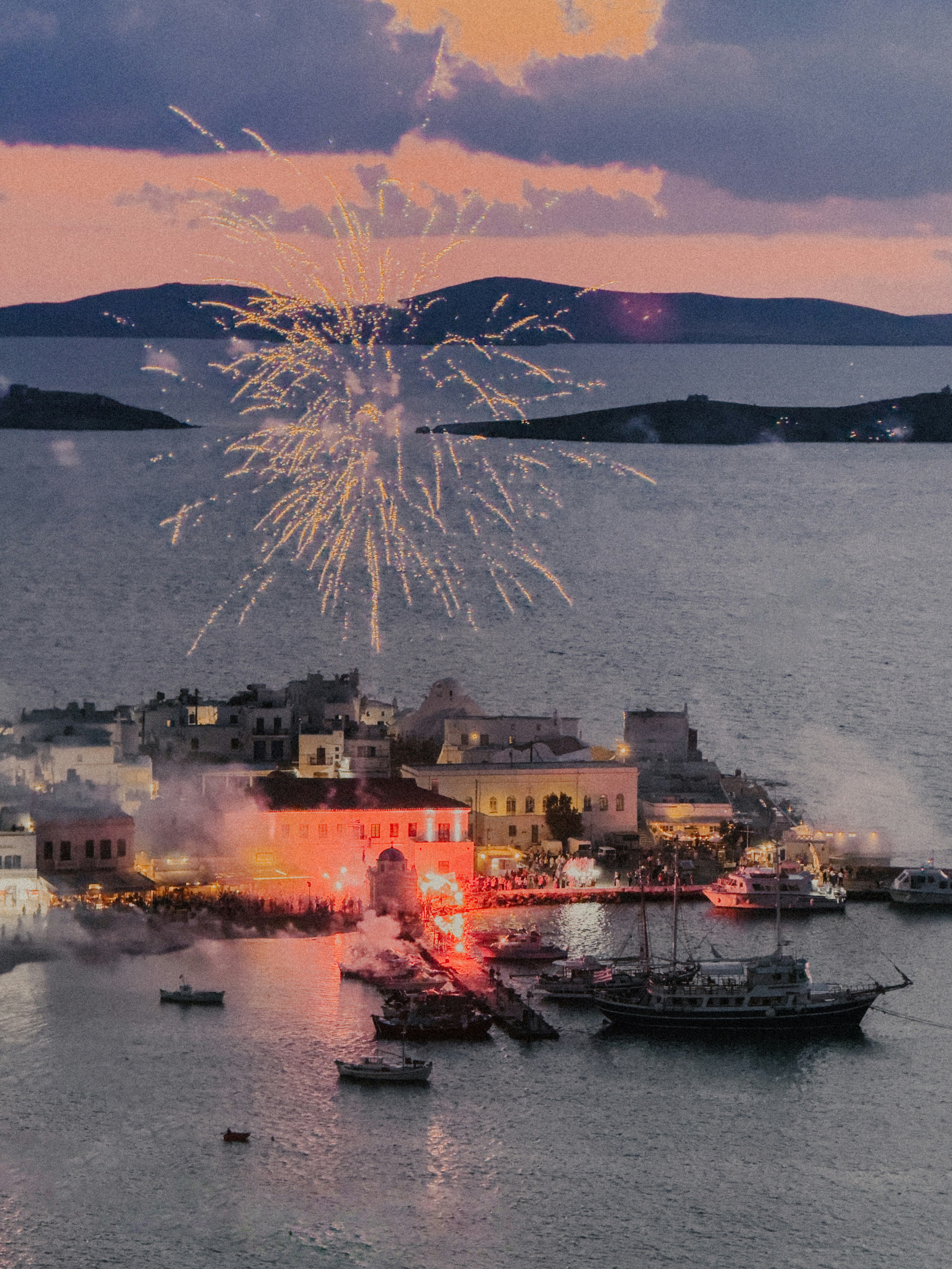Twilight Bursts Over a Lanterned Coastal Harbor