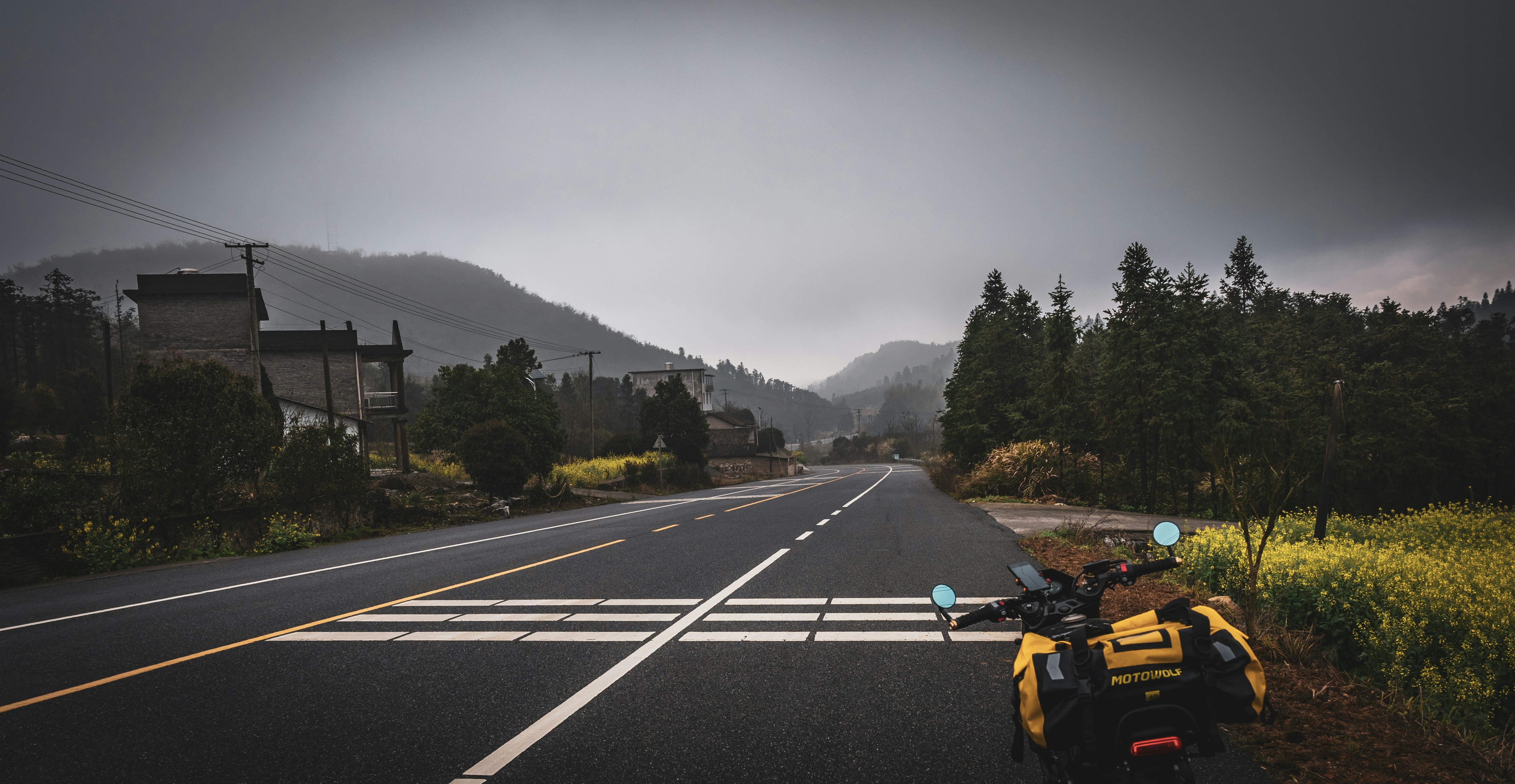 Mist-Lined Mountain Road: Gear at the Verge