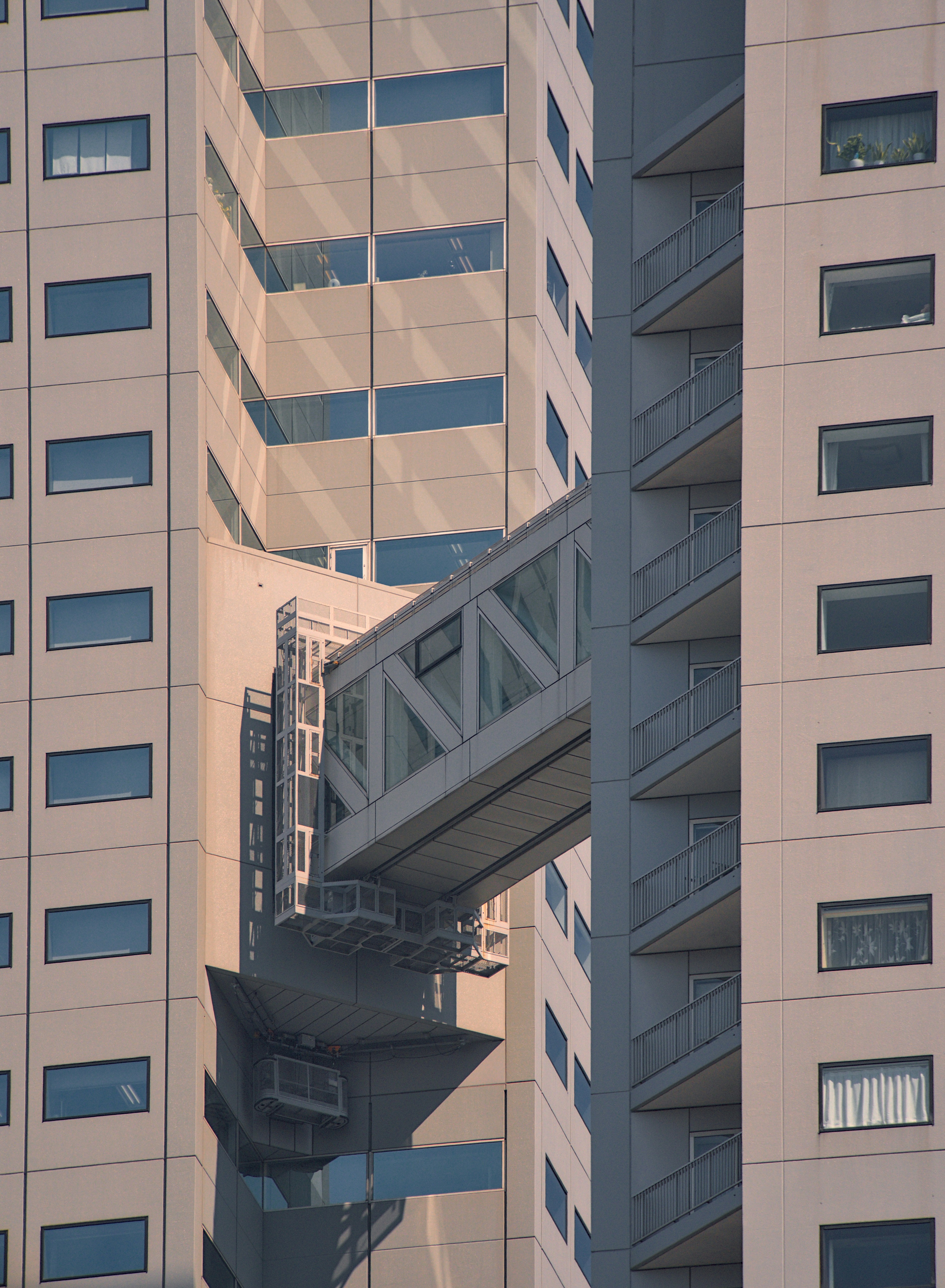 A bridge connects two modern buildings. photo – Free Texture Image on ...