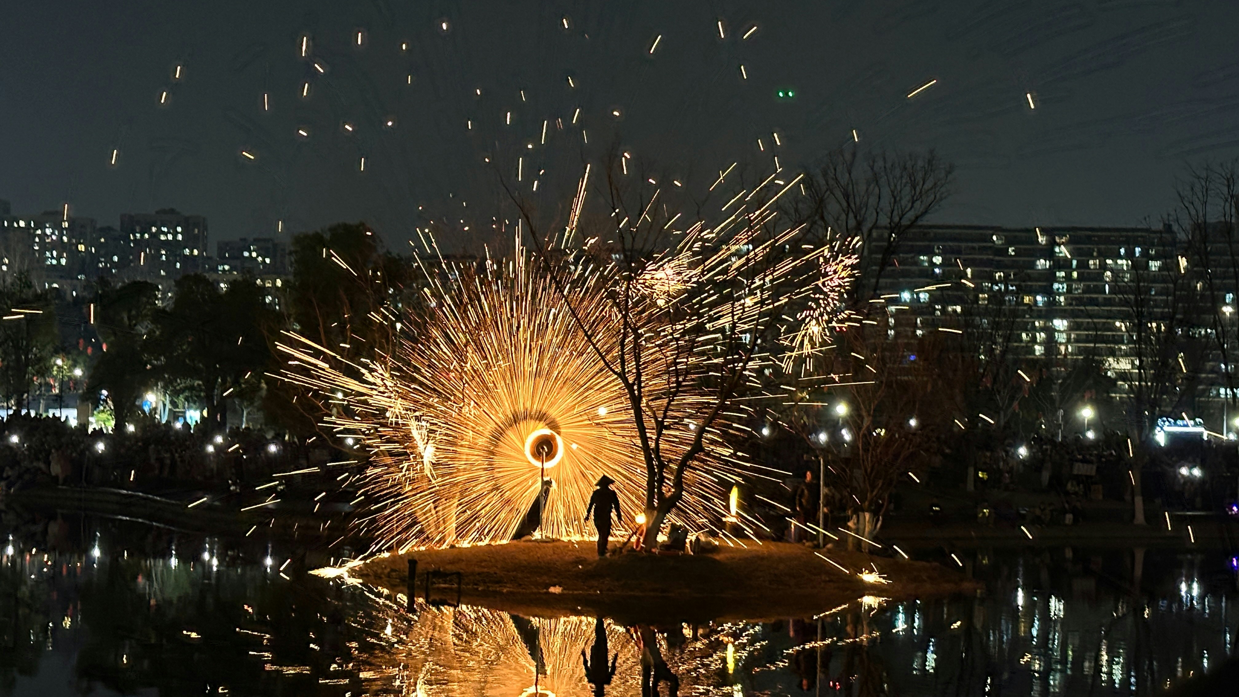 Sparks and silhouette create a stunning night scene. photo – Free City ...