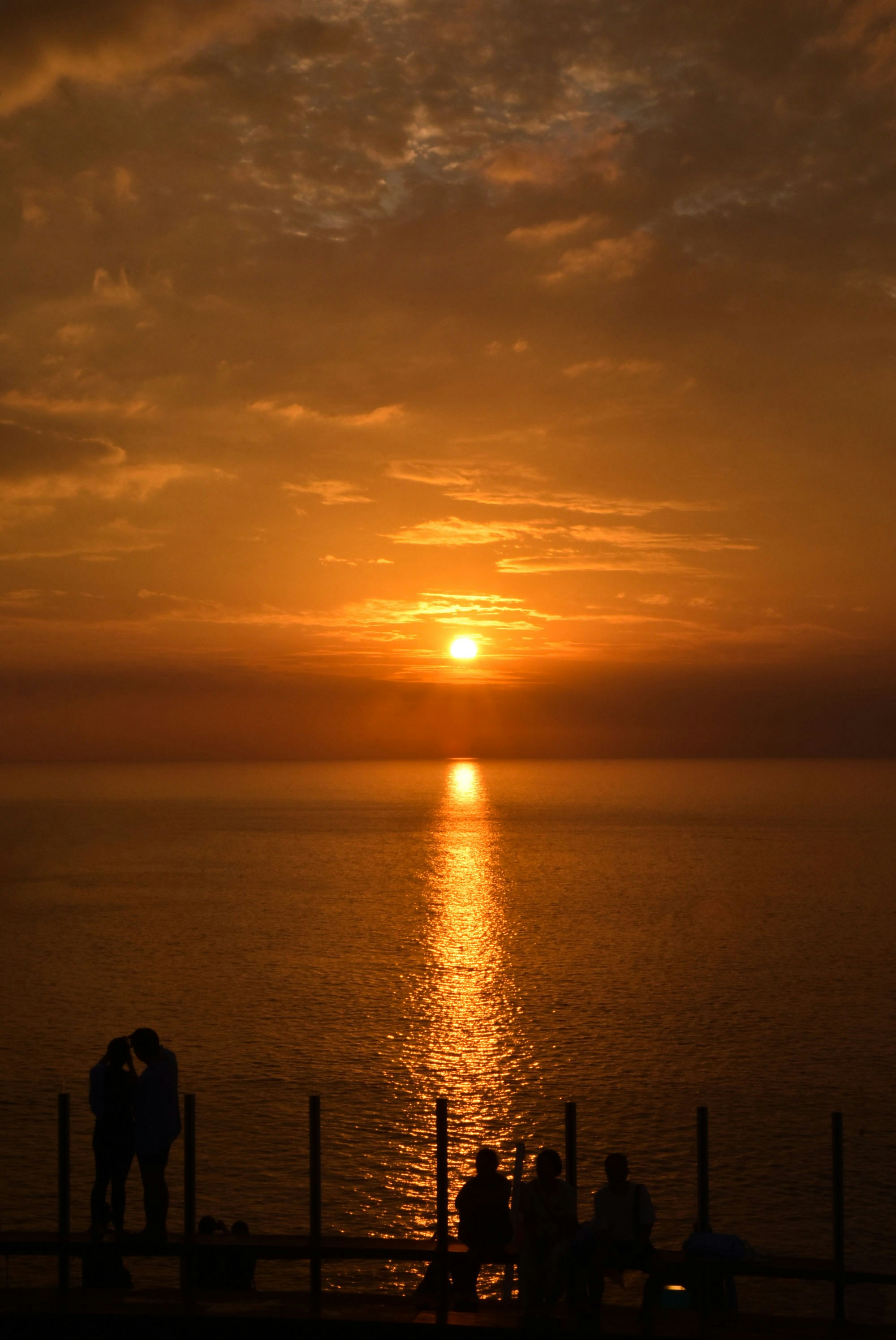 Horizon Ember: Silhouettes on the Dusk Pier