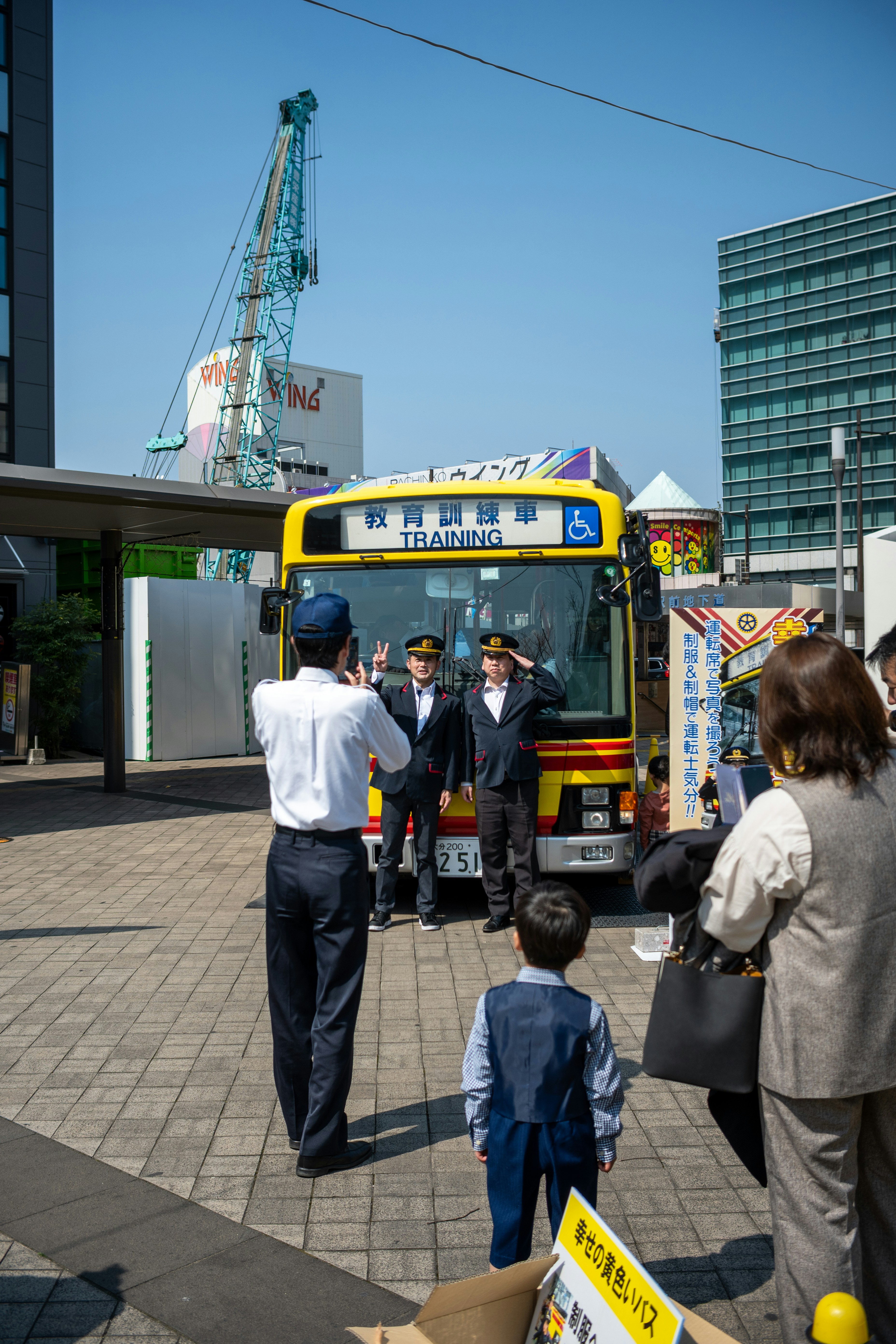 Bus staff pose for a picture in front of their vehicle. photo – Free ...