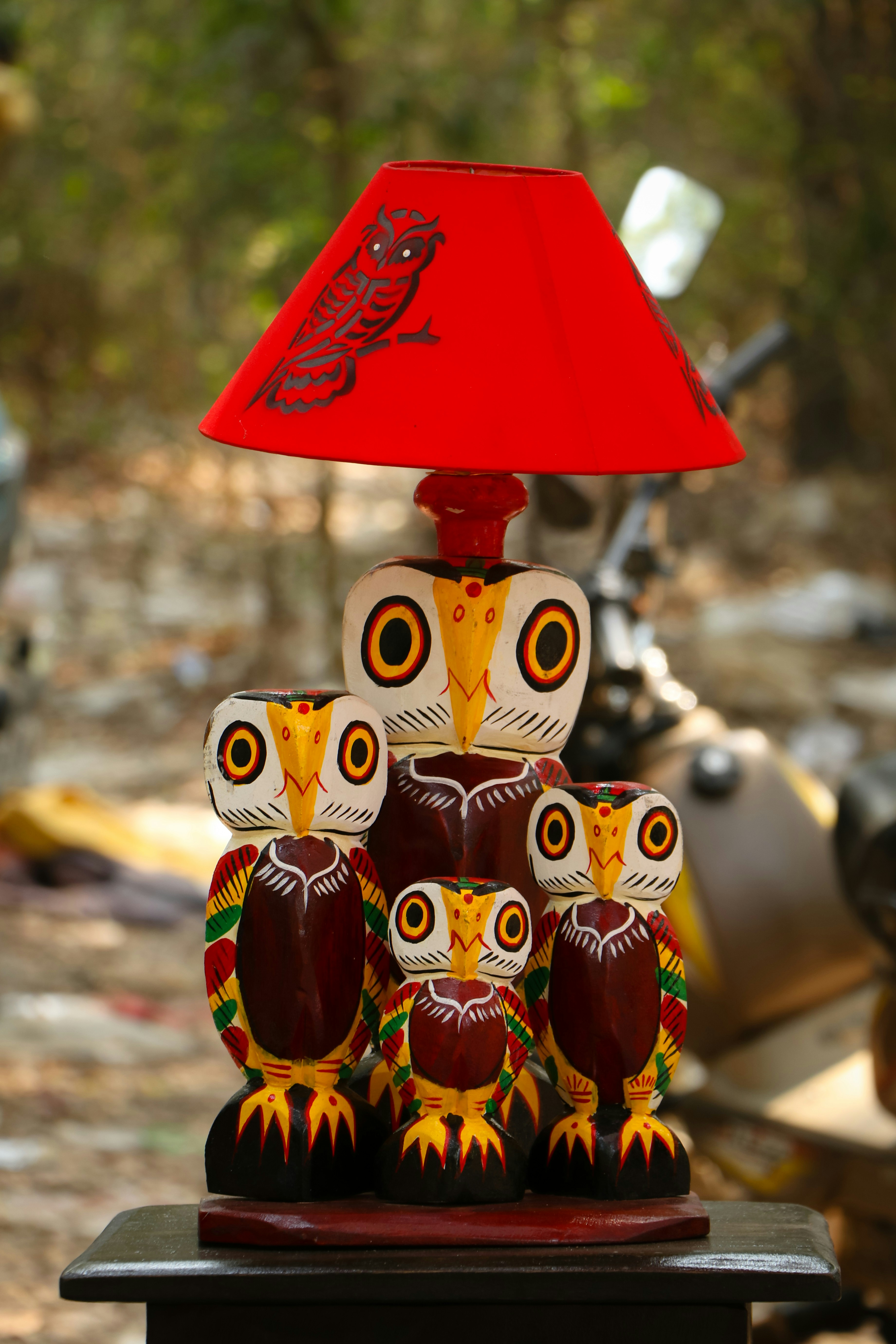 Owl Family Under a Scarlet Lampshade: A Quiet Still-Life Tableau