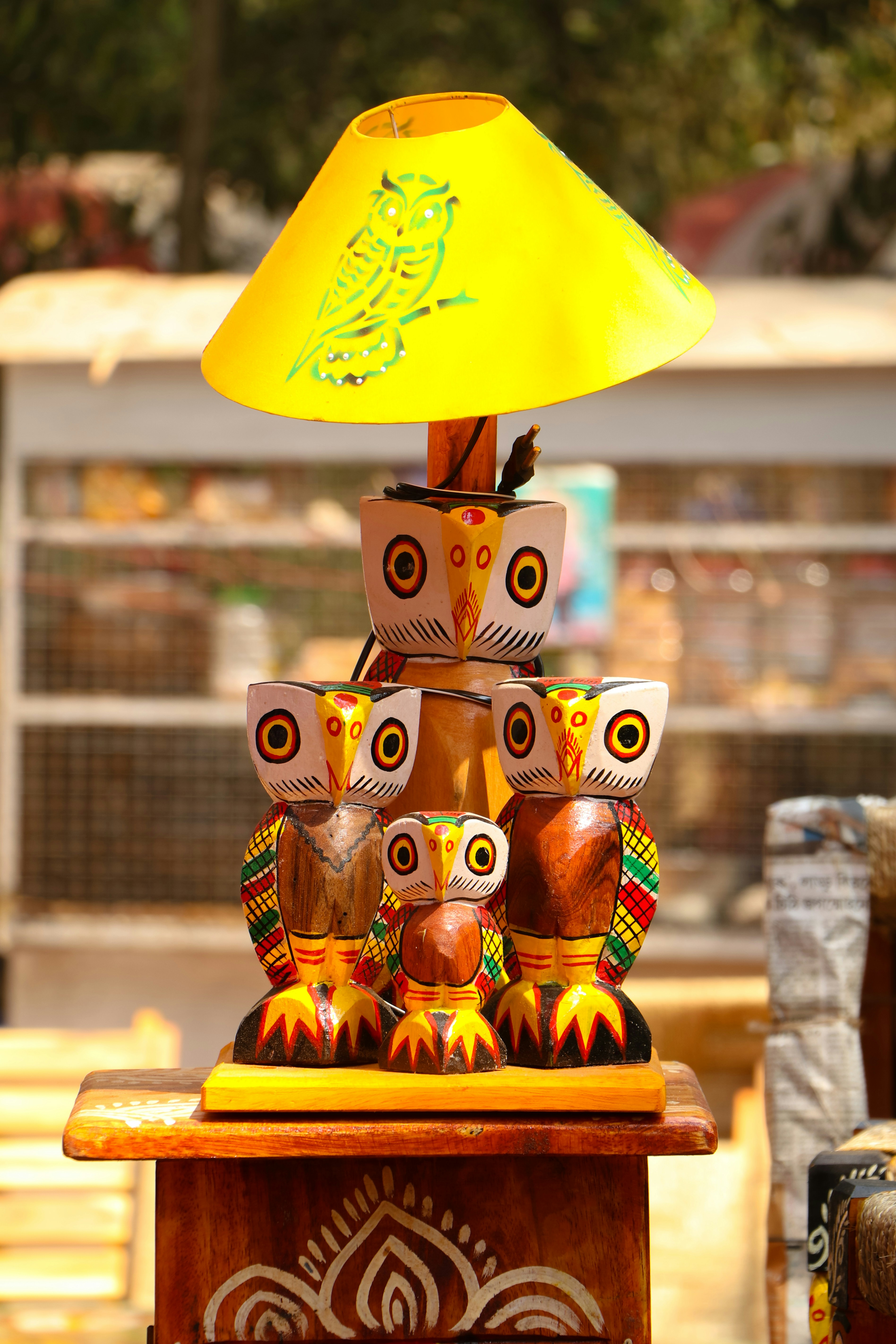 Sunlit Owl Totem: A Cheerful Stack of Hand-Painted Carvings