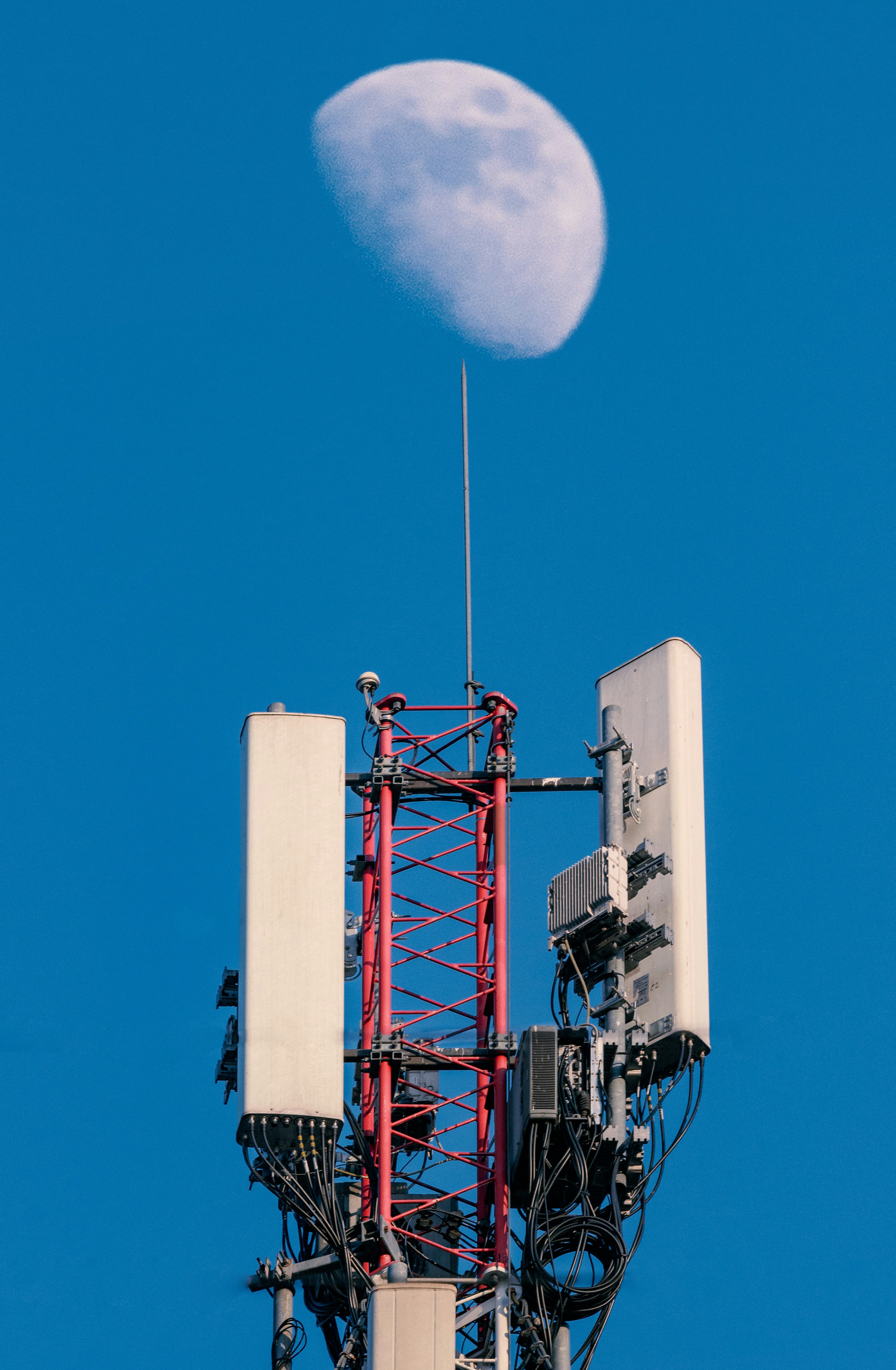 Cell tower and the moon against a bright sky. photo – Free Space Image ...