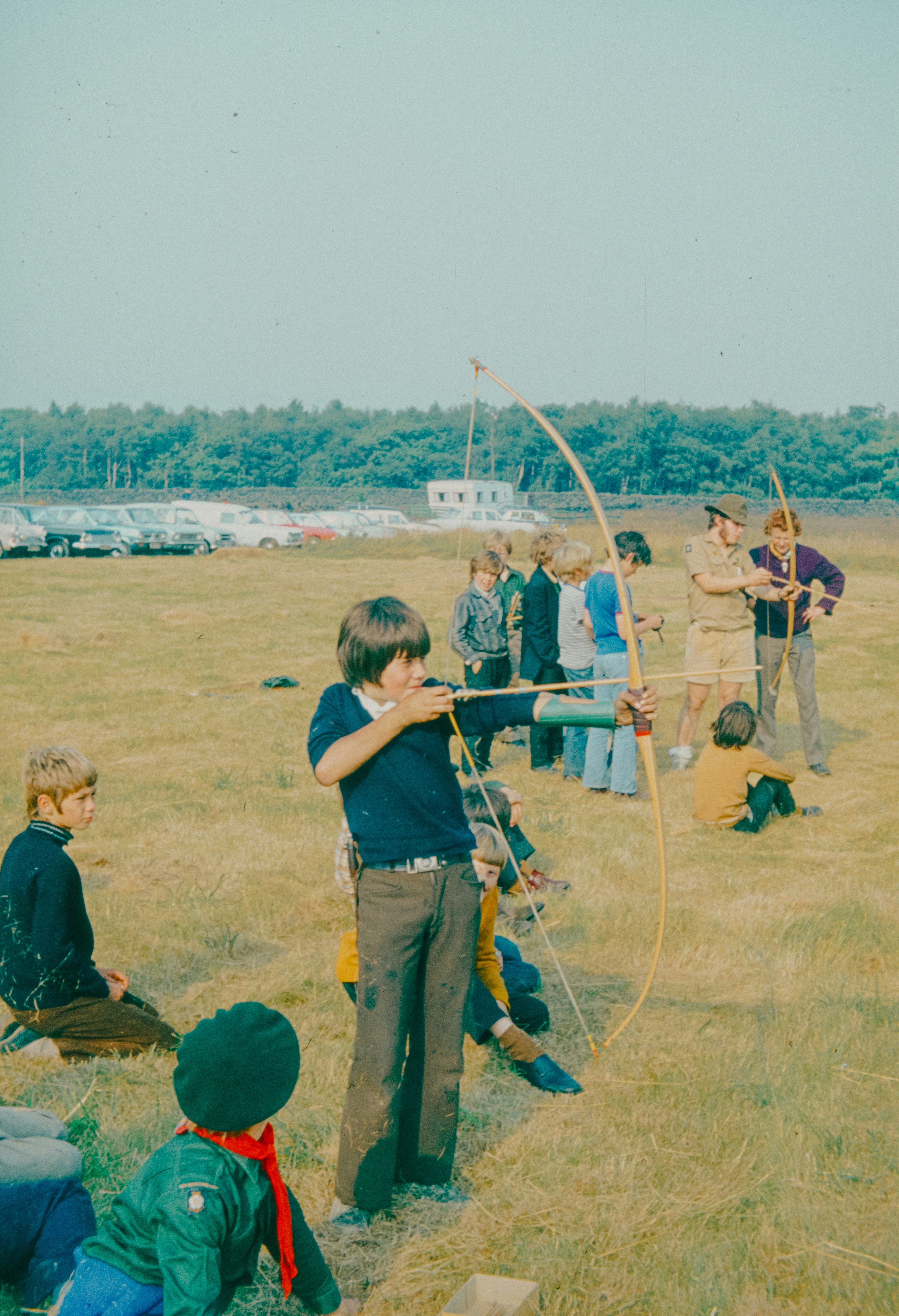 Children are practicing archery outdoors in a field. photo – Free ...