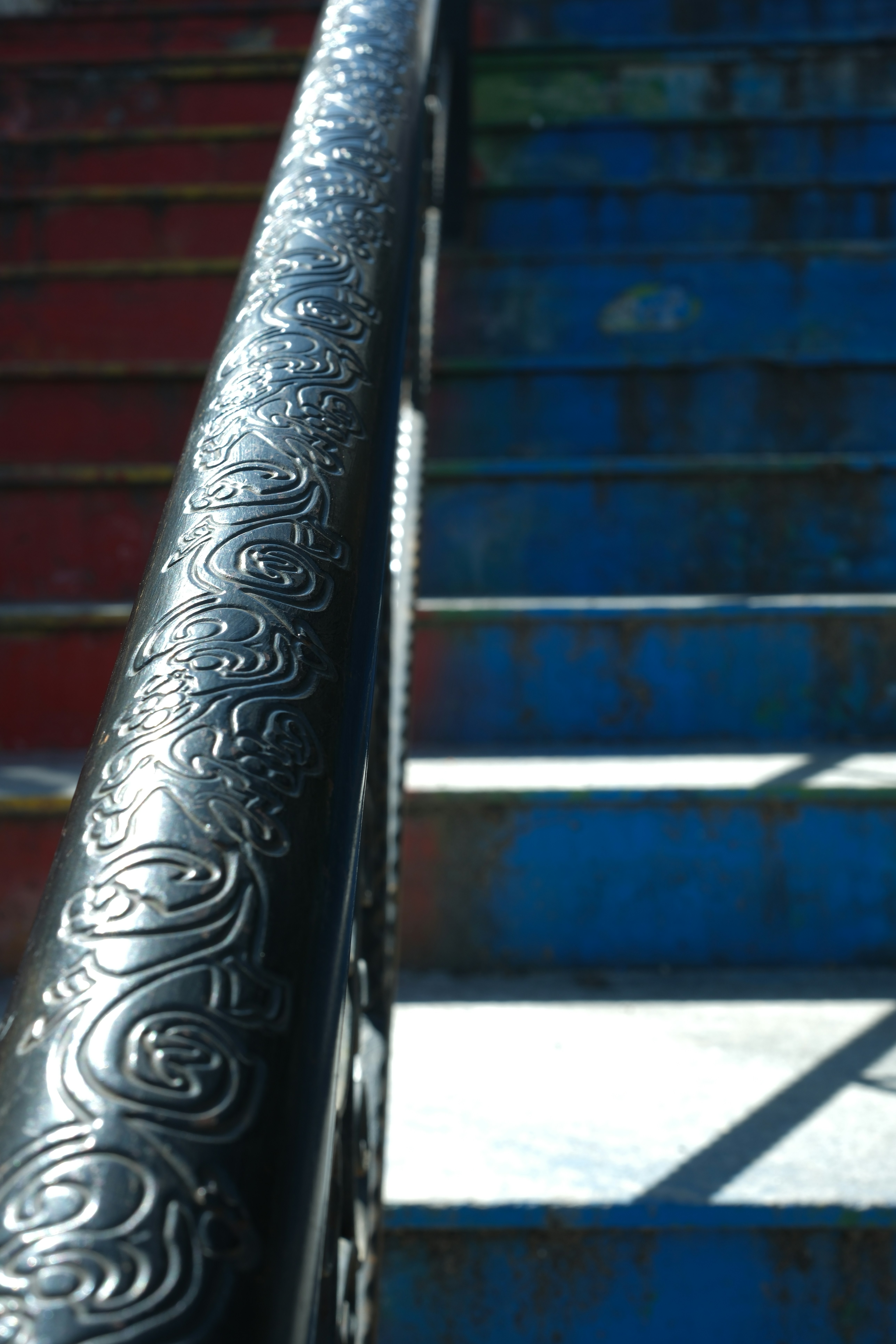Ironwork in Focus: Close-Up of a Textured Stair Rail