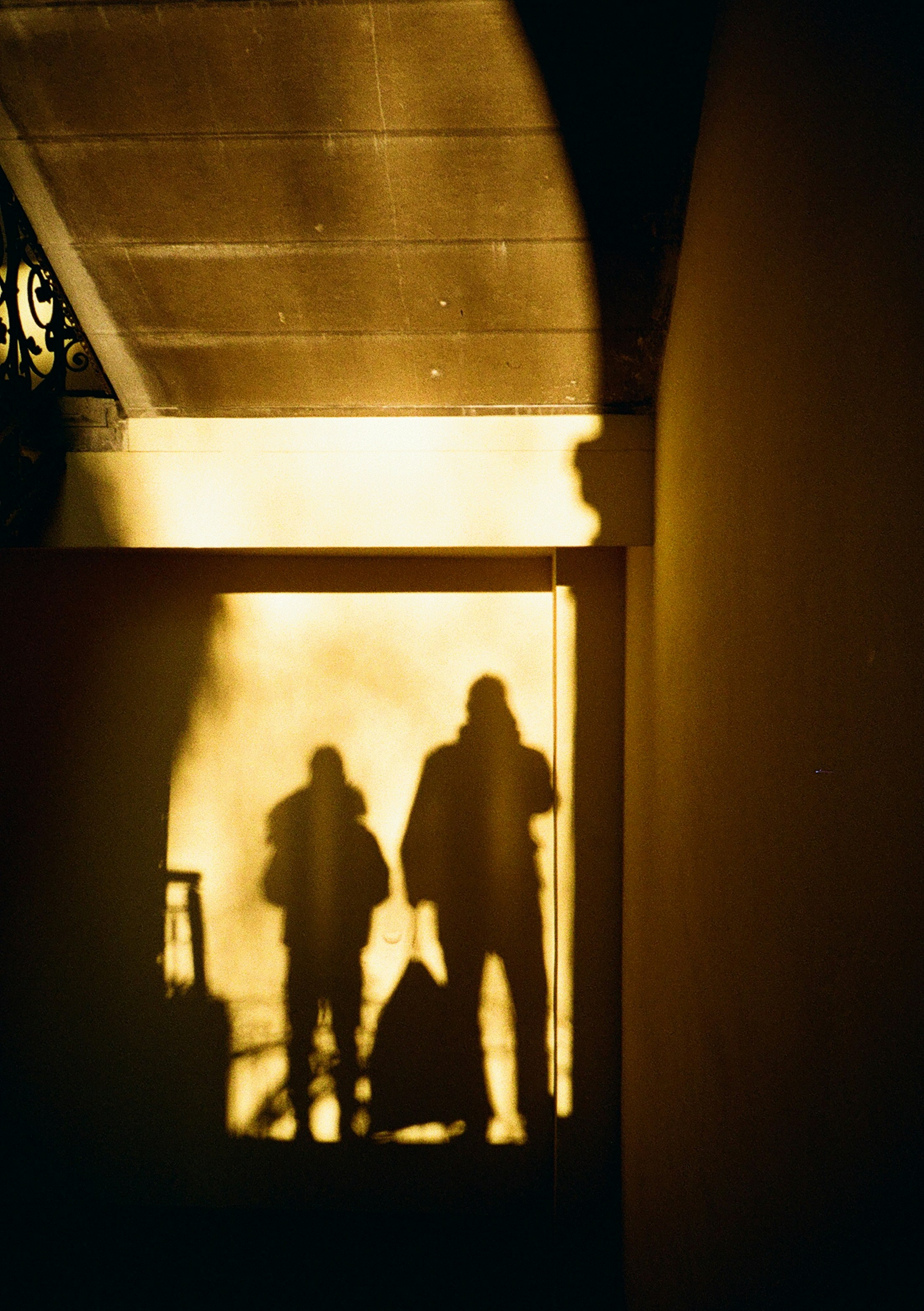 Shadows of two figures cast through a doorway. photo – Free Film ...