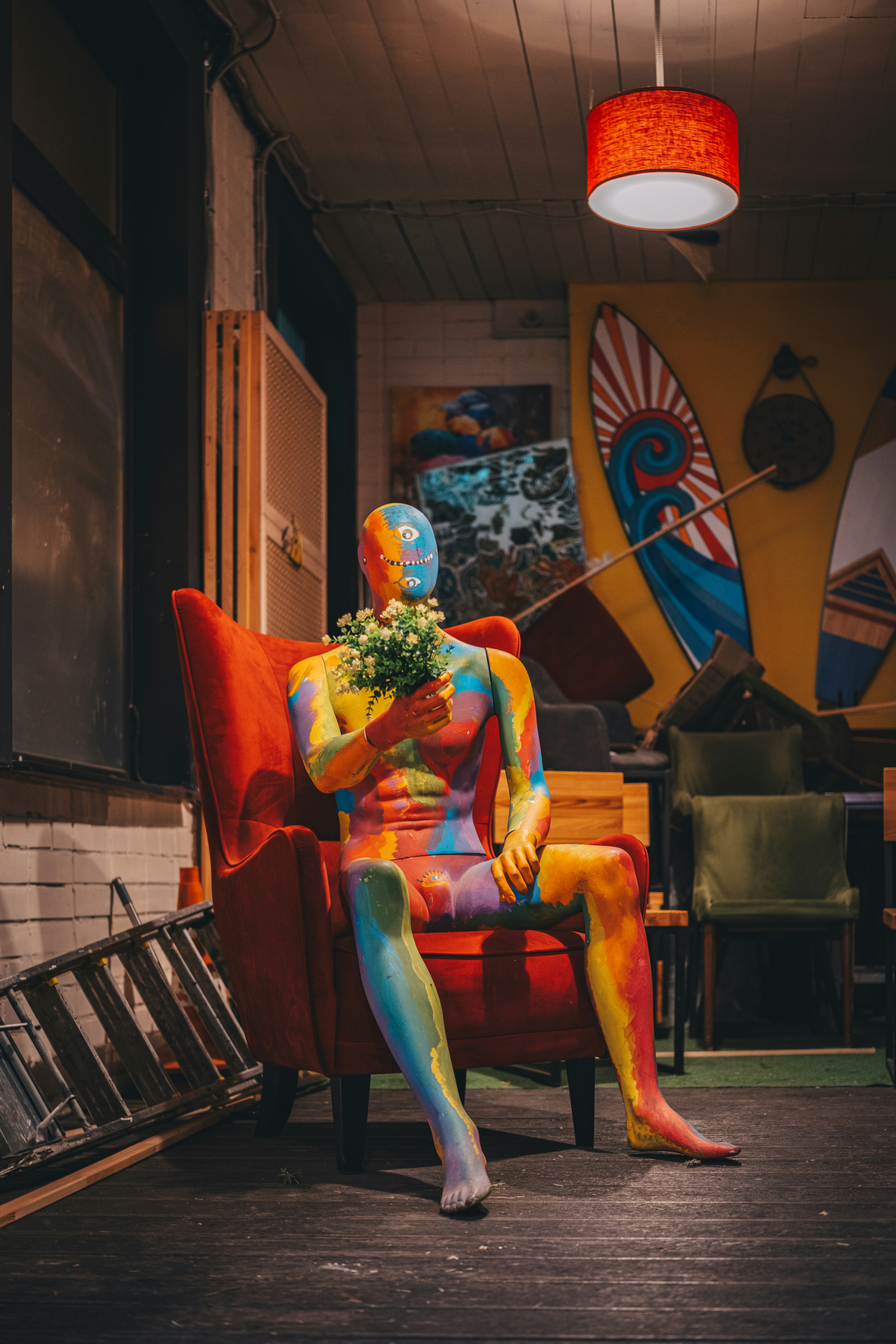 Chromatic Muse in a Red Armchair Amid Surfboard Murals