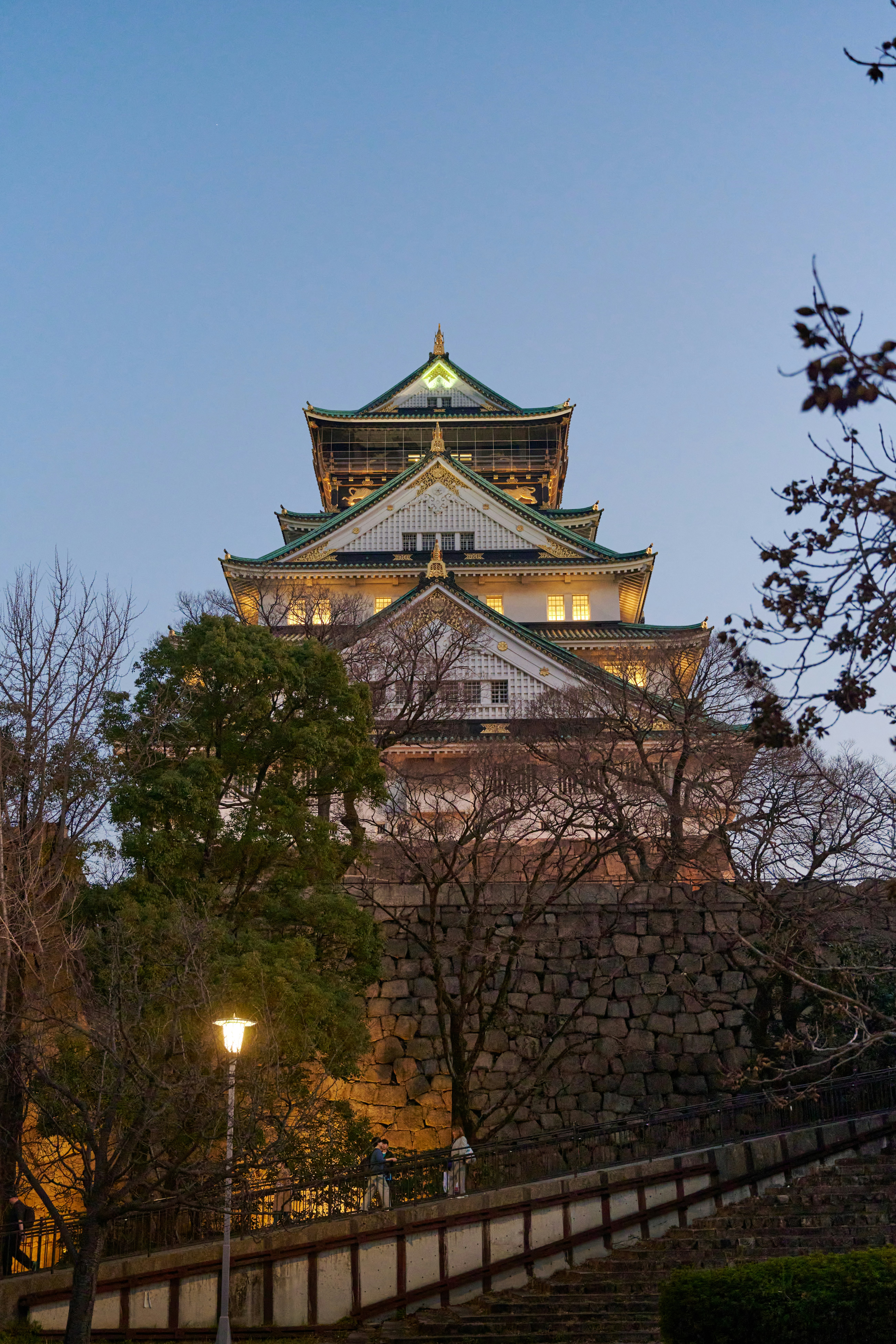 Dusk Glow Over a Tiered Japanese Castle Tower