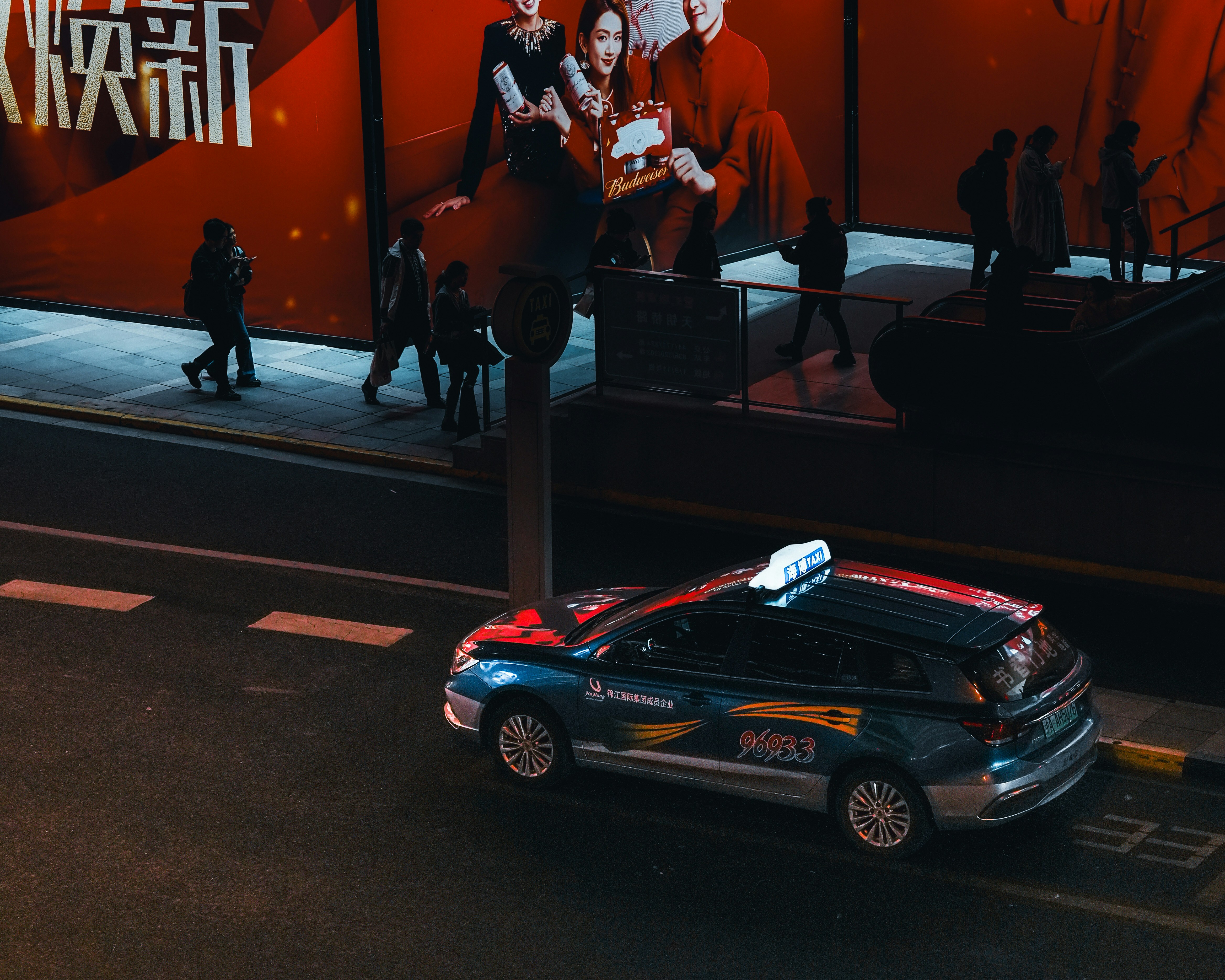 Midnight Taxi on a Red-Walled Street