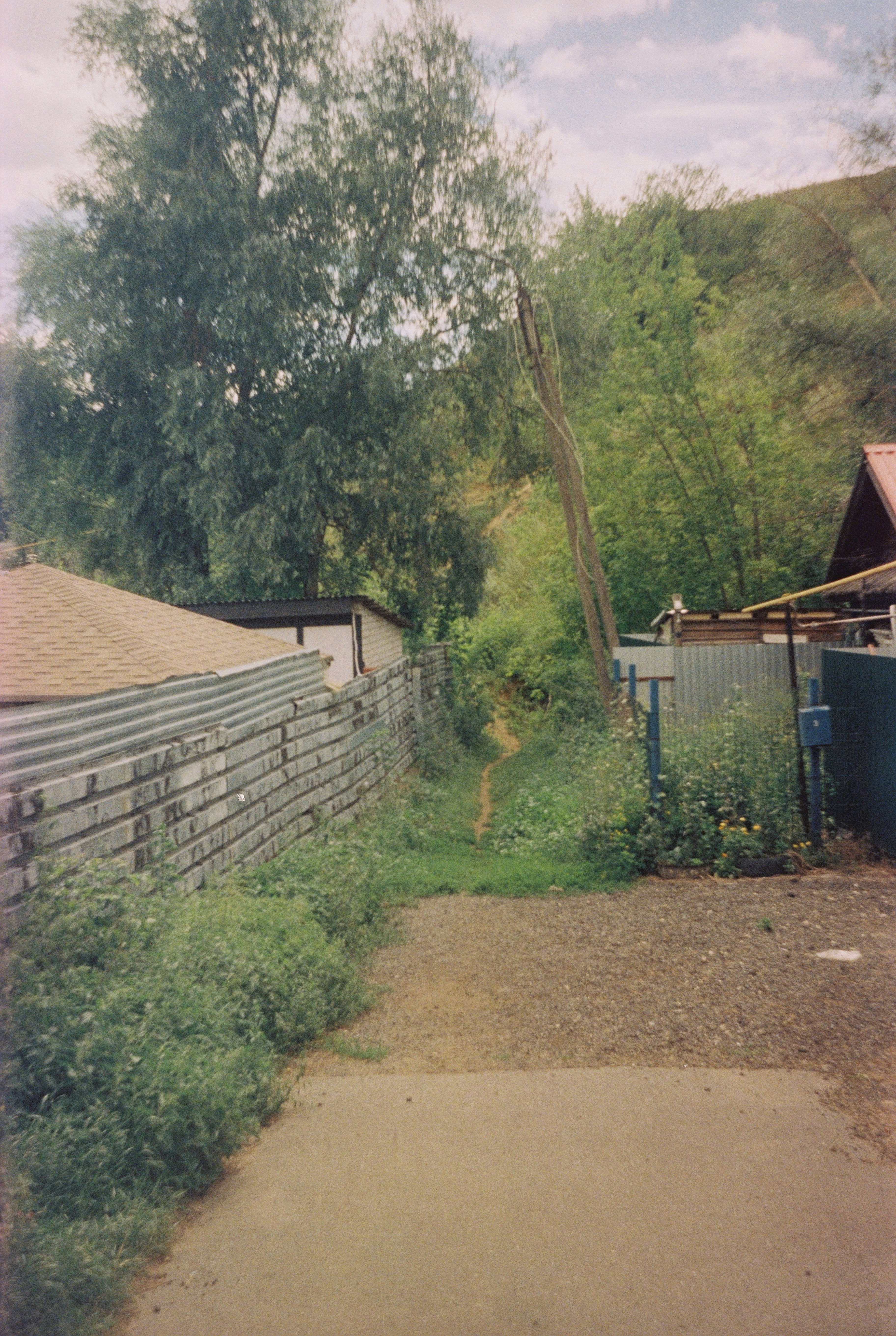 Quiet Pathway Between Rustic Homes