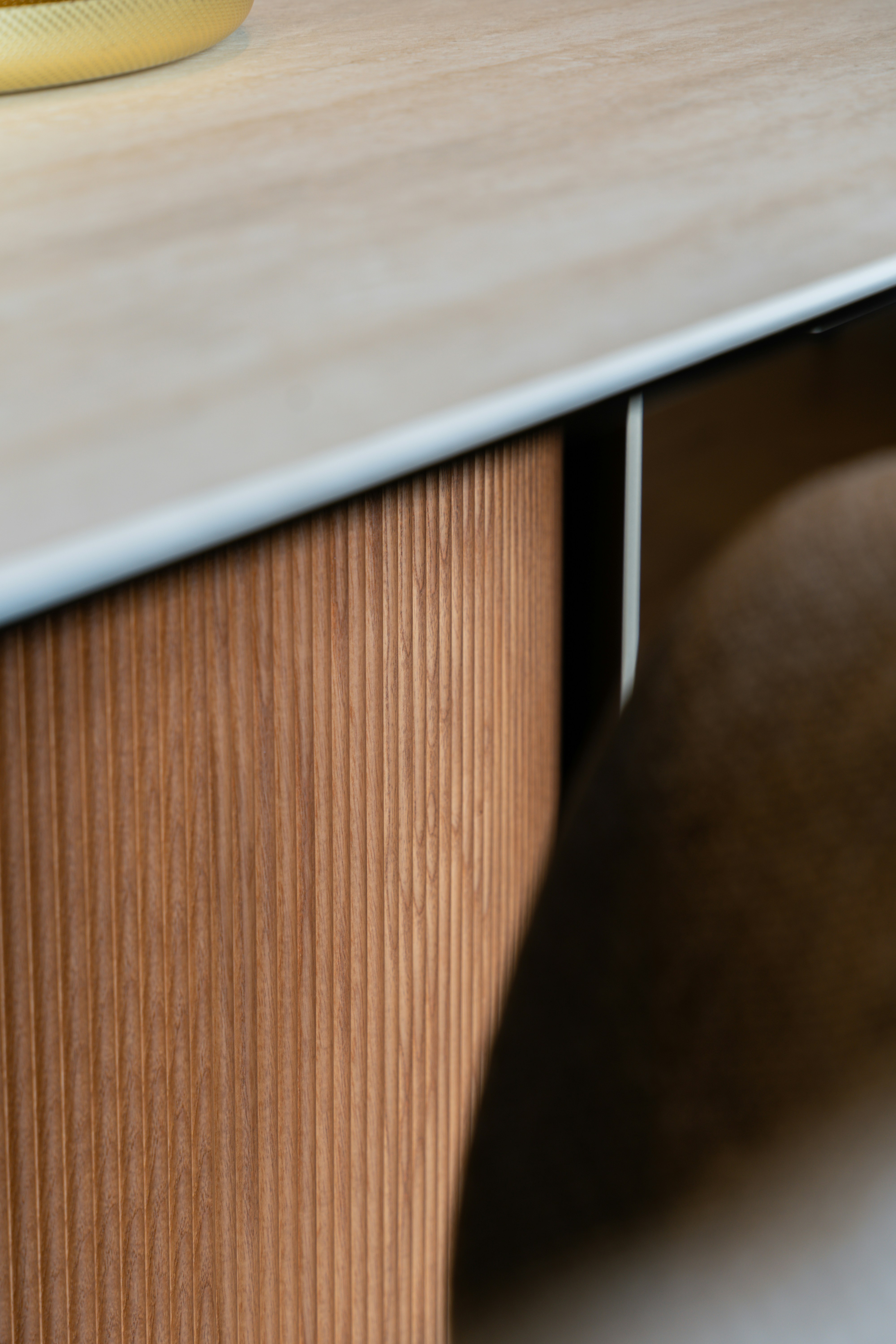 Wooden table corner with vertical grooves and a chair. photo – Free Man ...