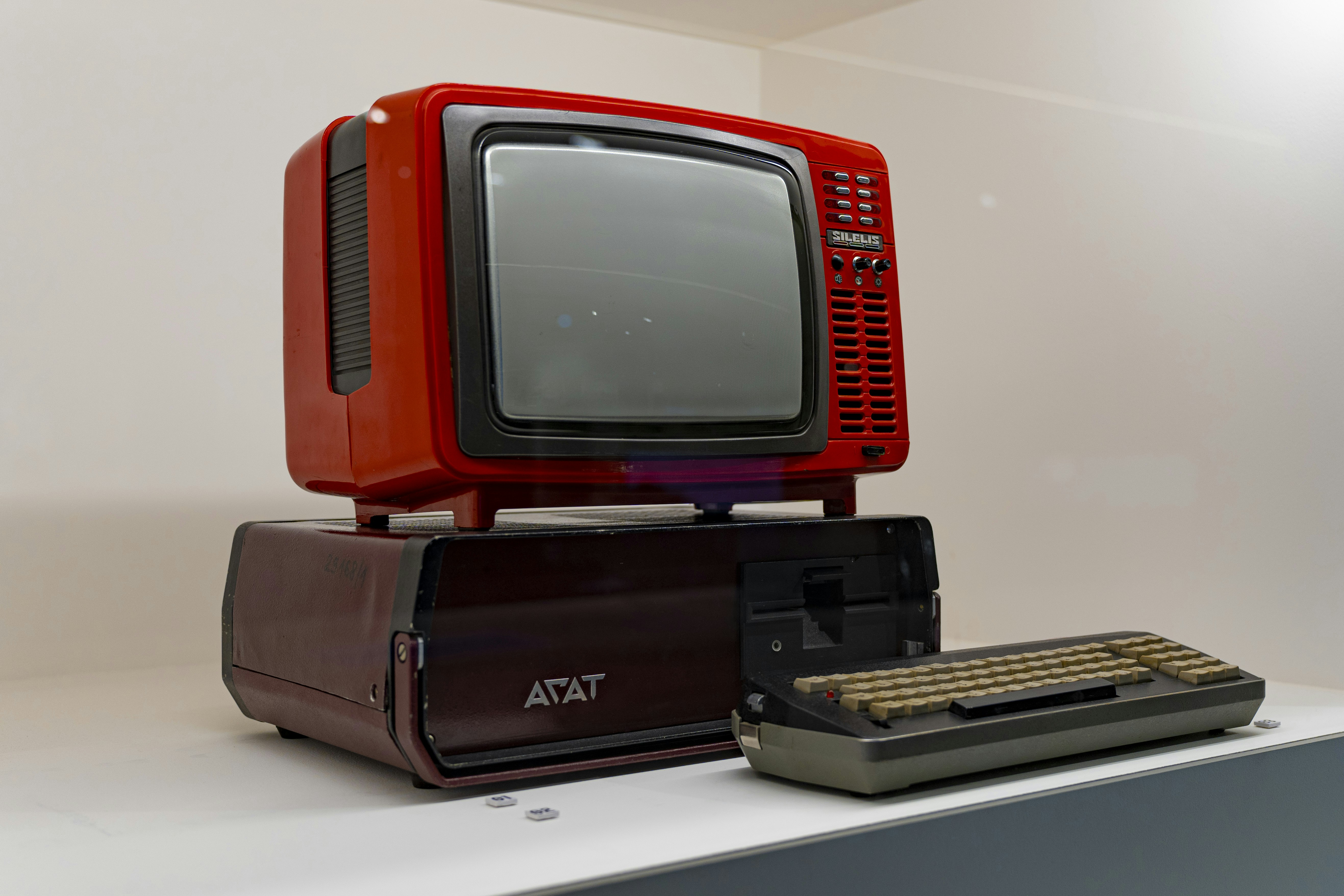 An old red television, at&t computer, and keyboard. photo – Free ...