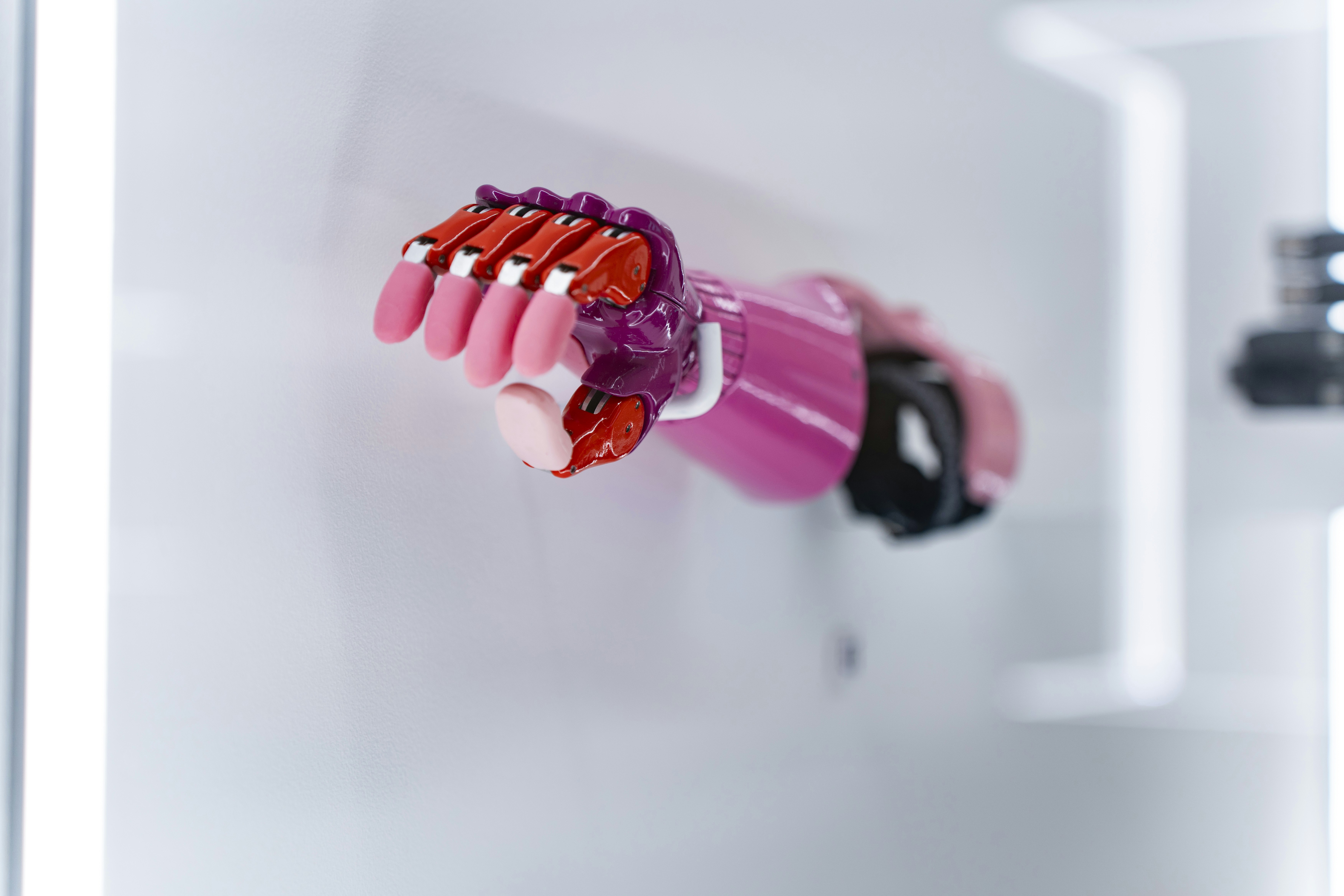 A pink prosthetic hand with a fist. photo – Free Cosmetics Image on ...