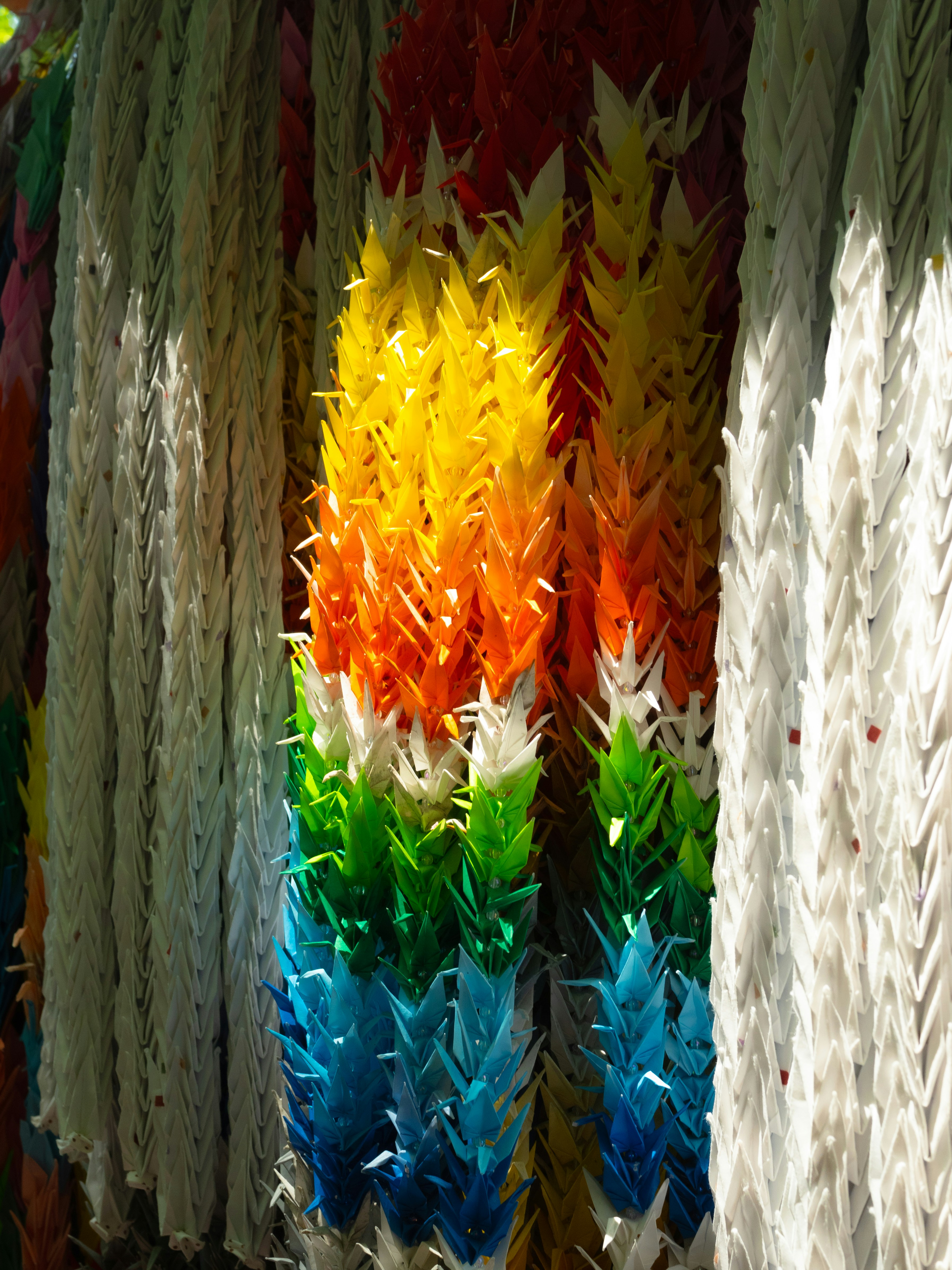Prismatic Origami Cascade: A Vertical Rainbow of Paper Cranes