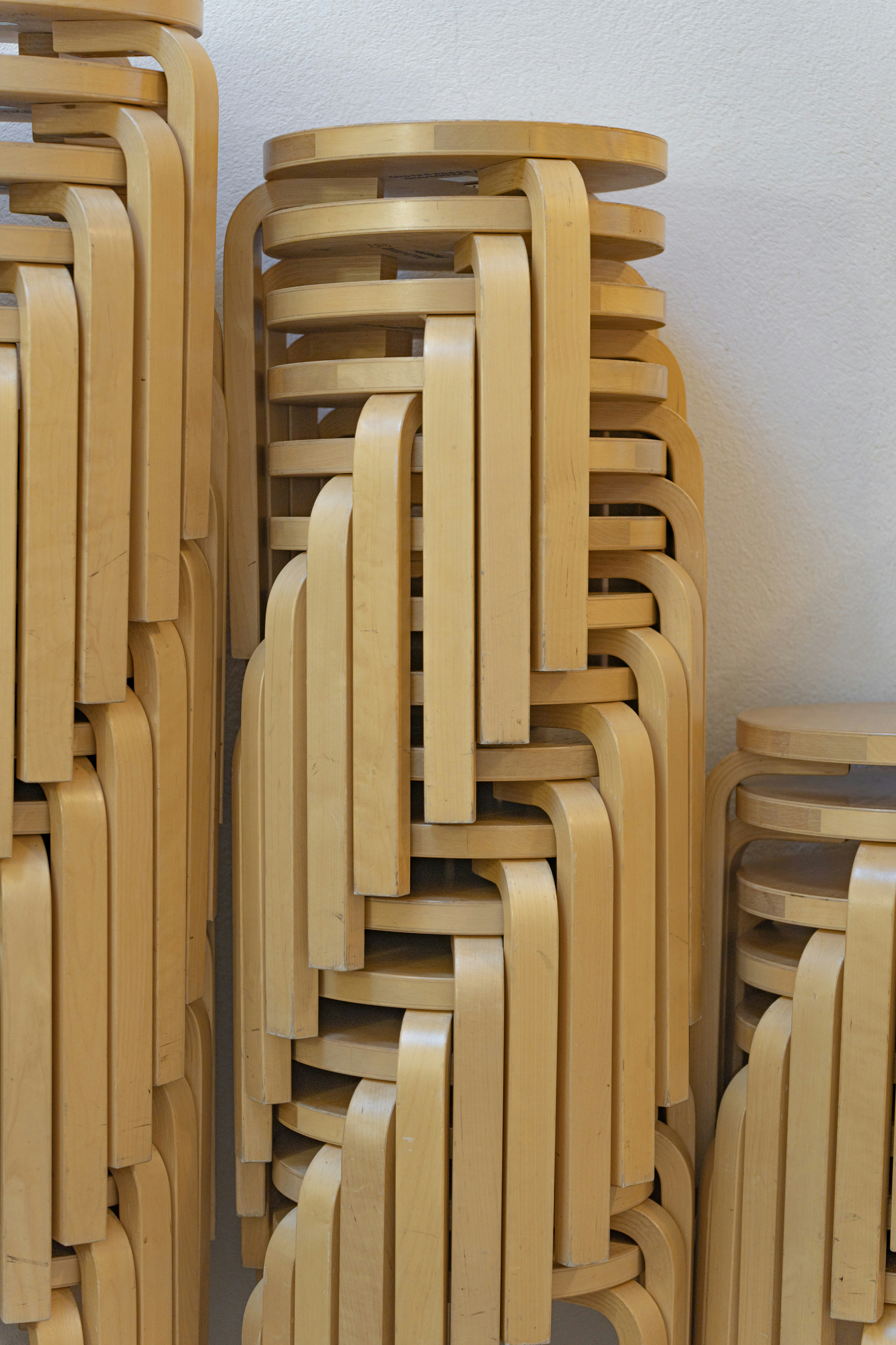Stacked wooden stools create a unique geometric pattern. photo – Free ...