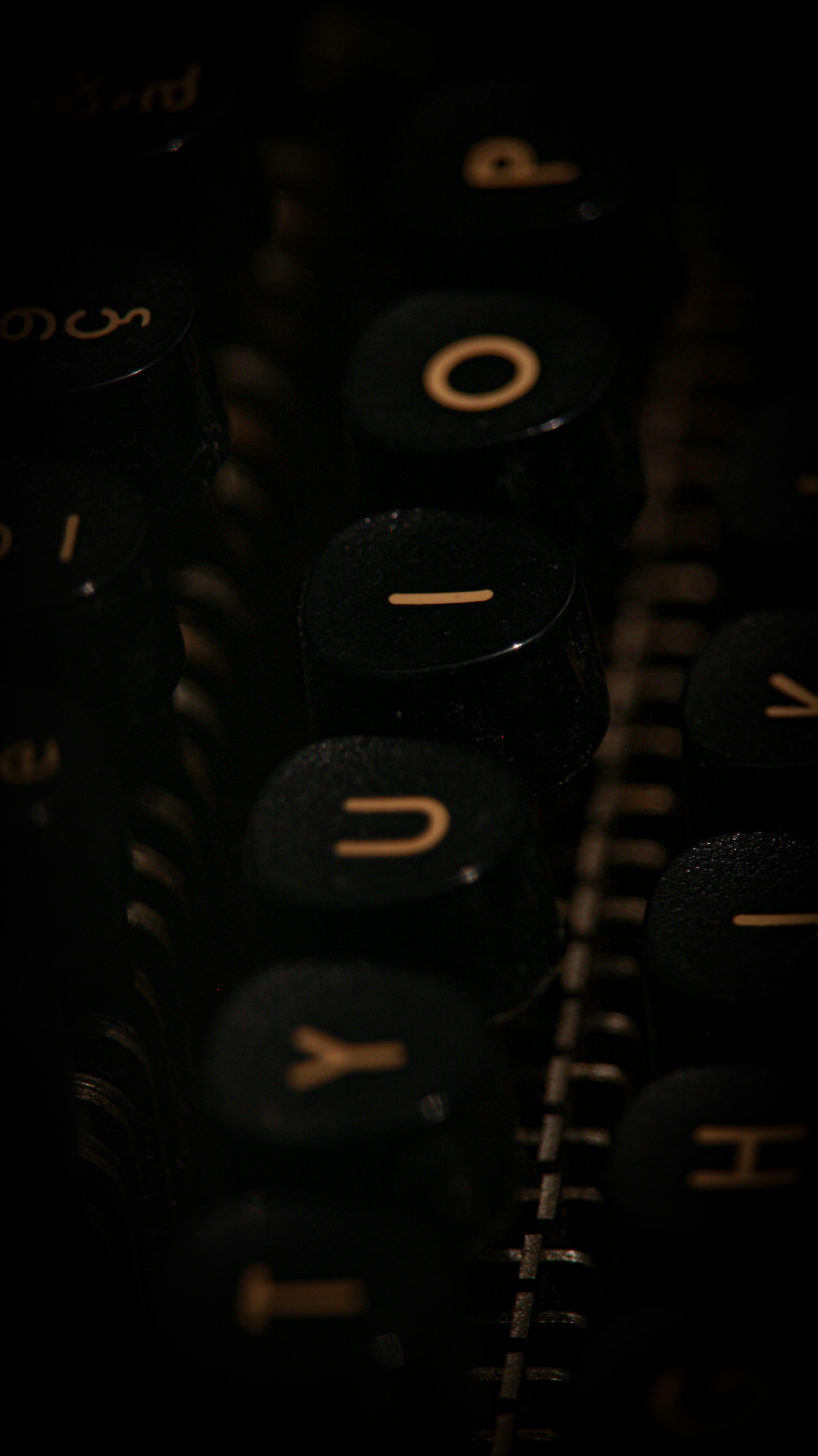 Midnight Macro: Close-Up on Vintage Typewriter Keys in Low Light