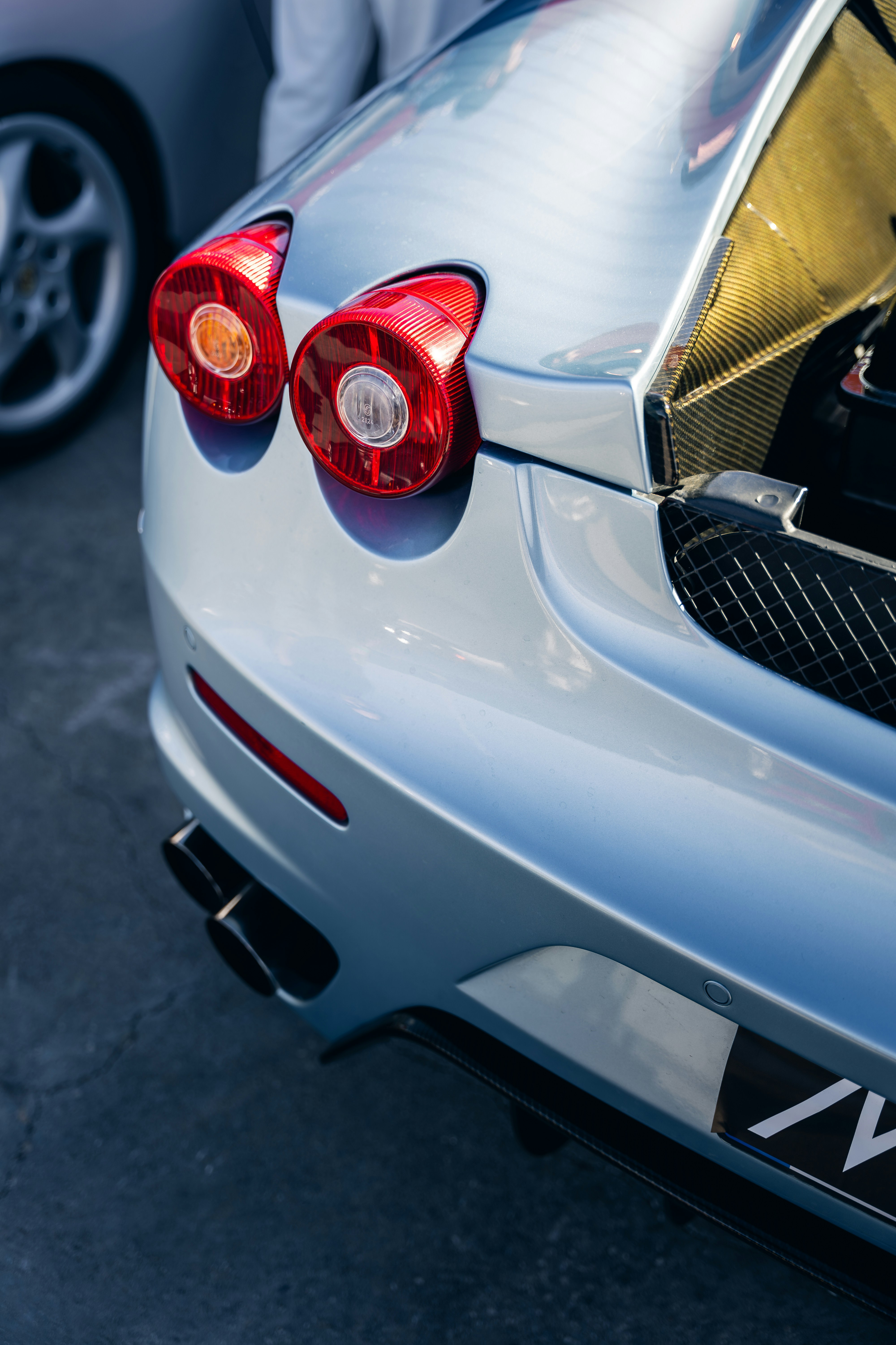 Close-up of a sleek blue sports car's rear. photo – Free Car Image on ...