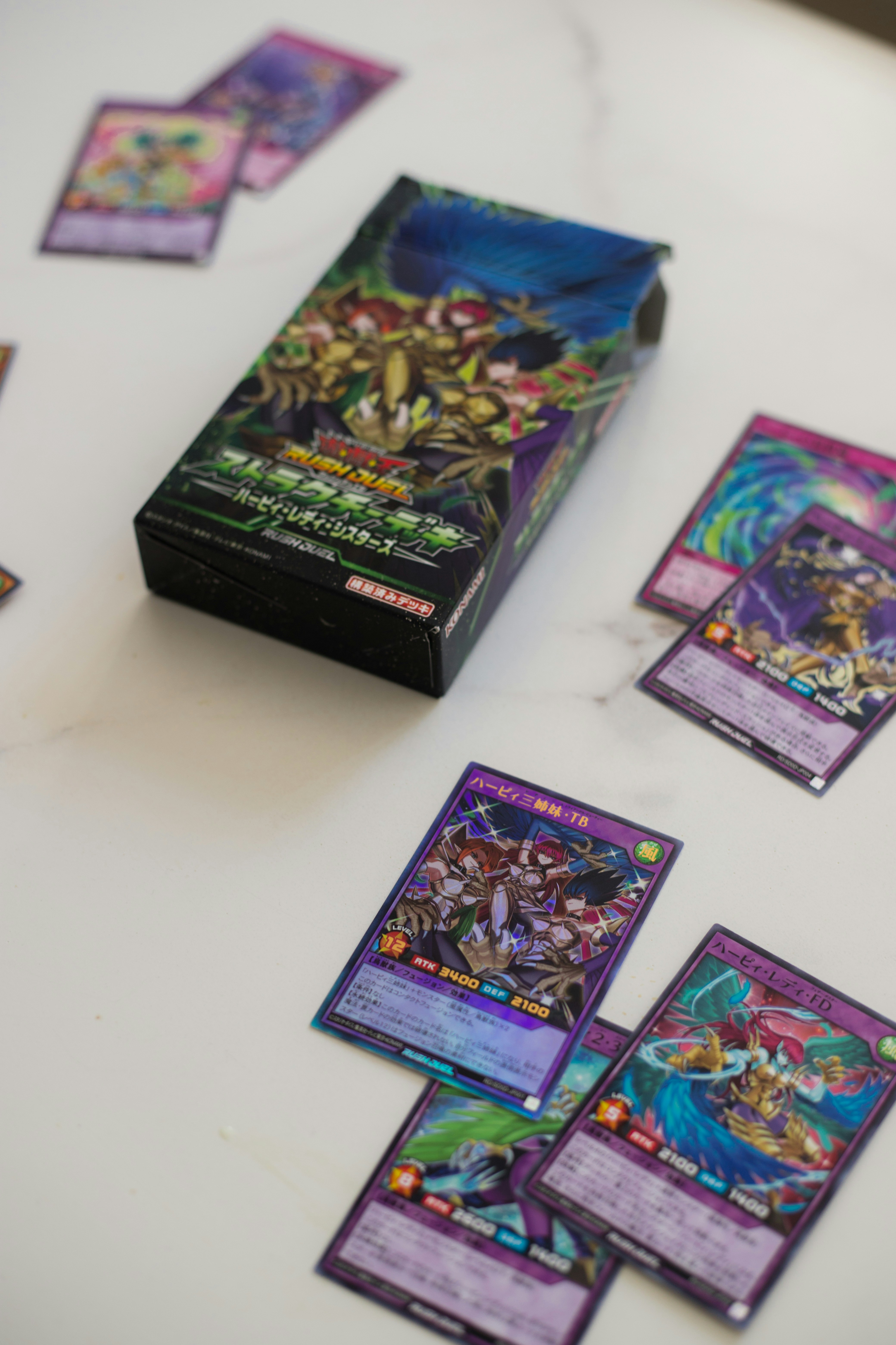 Yu-gi-oh! cards and a booster pack are displayed. photo – Free Human ...