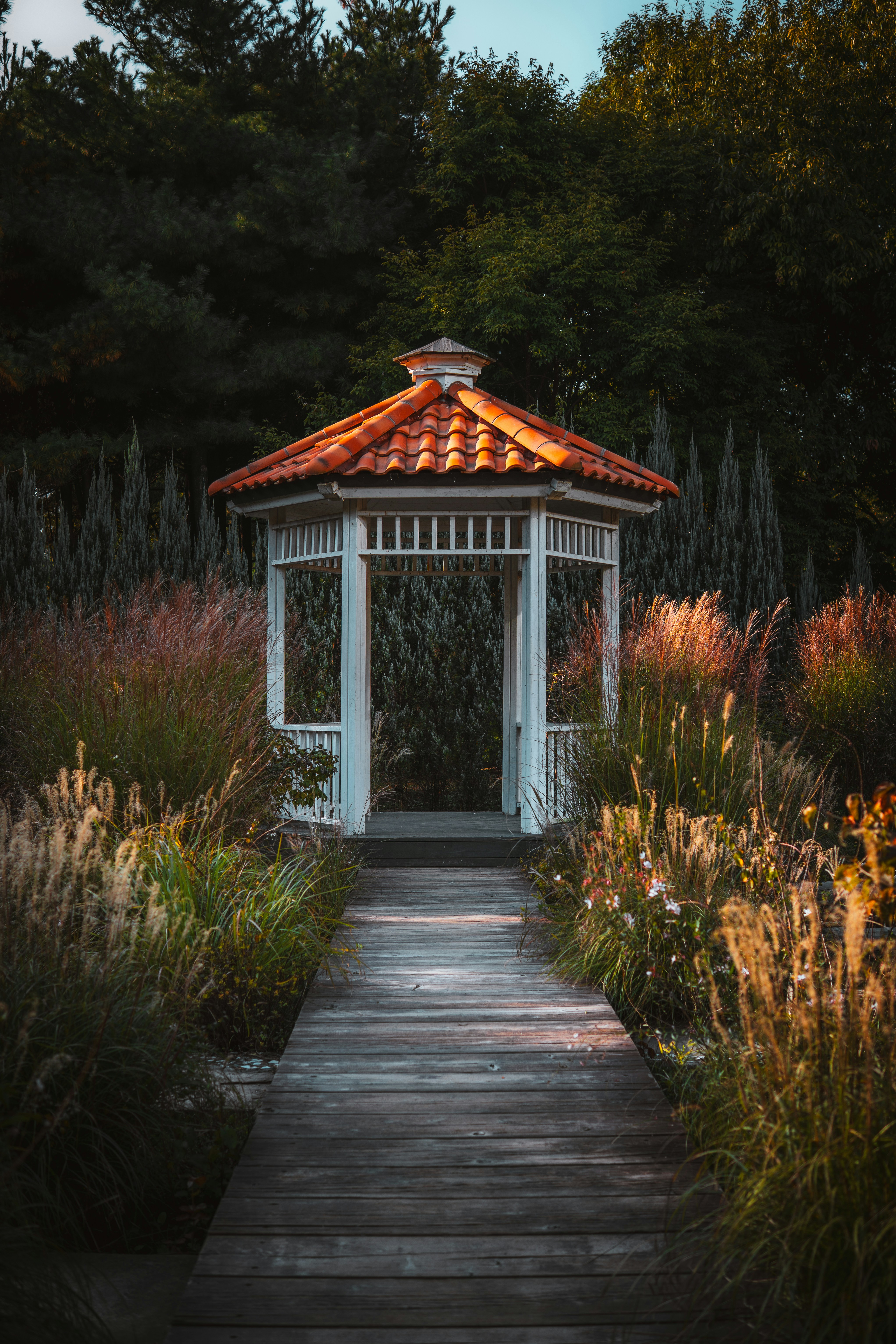Red-Tiled Gazebo at the End of a Quiet Garden Path