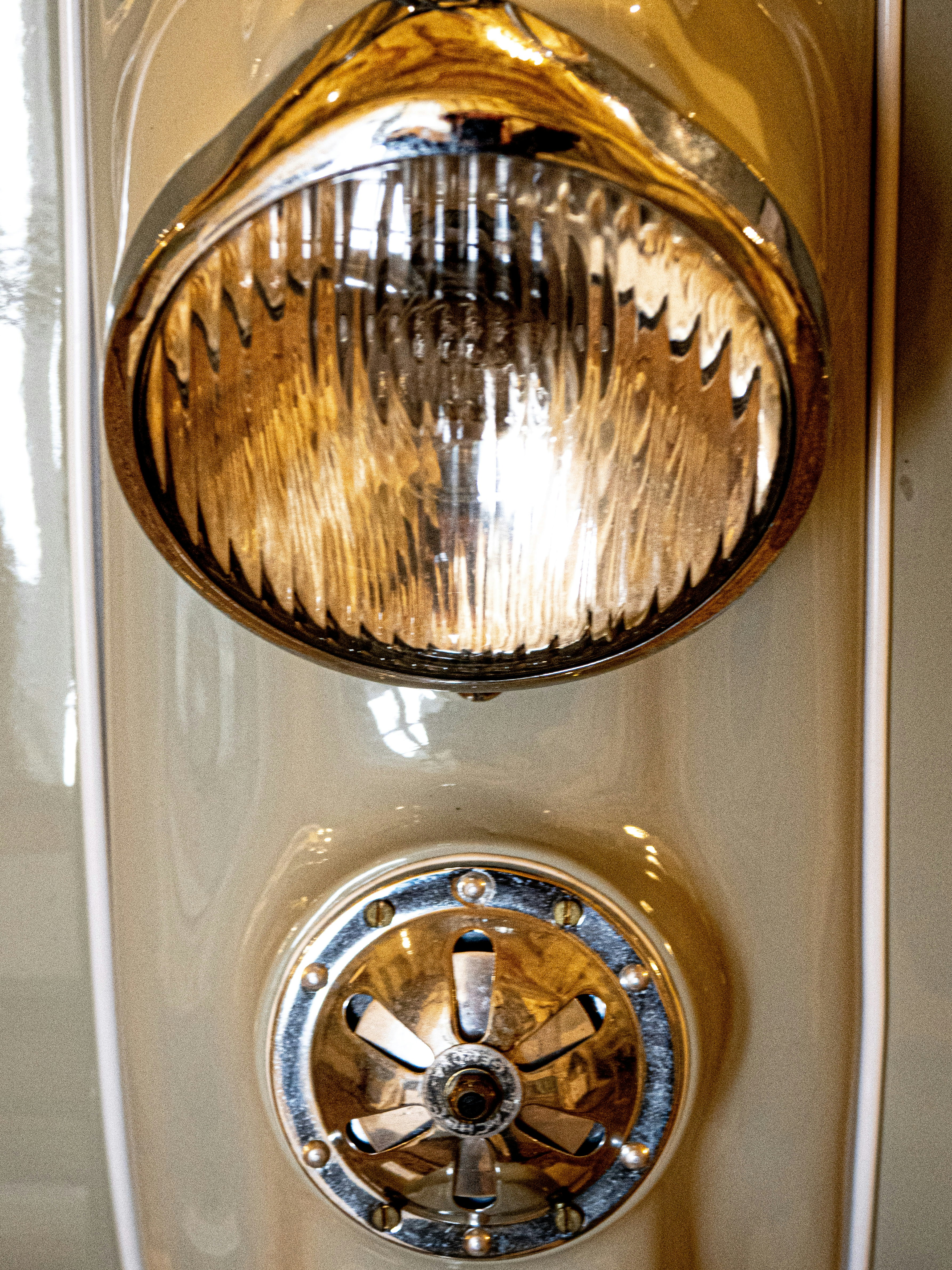 Amber Gleam: Close-Up of a Vintage Headlamp and Chrome Detail