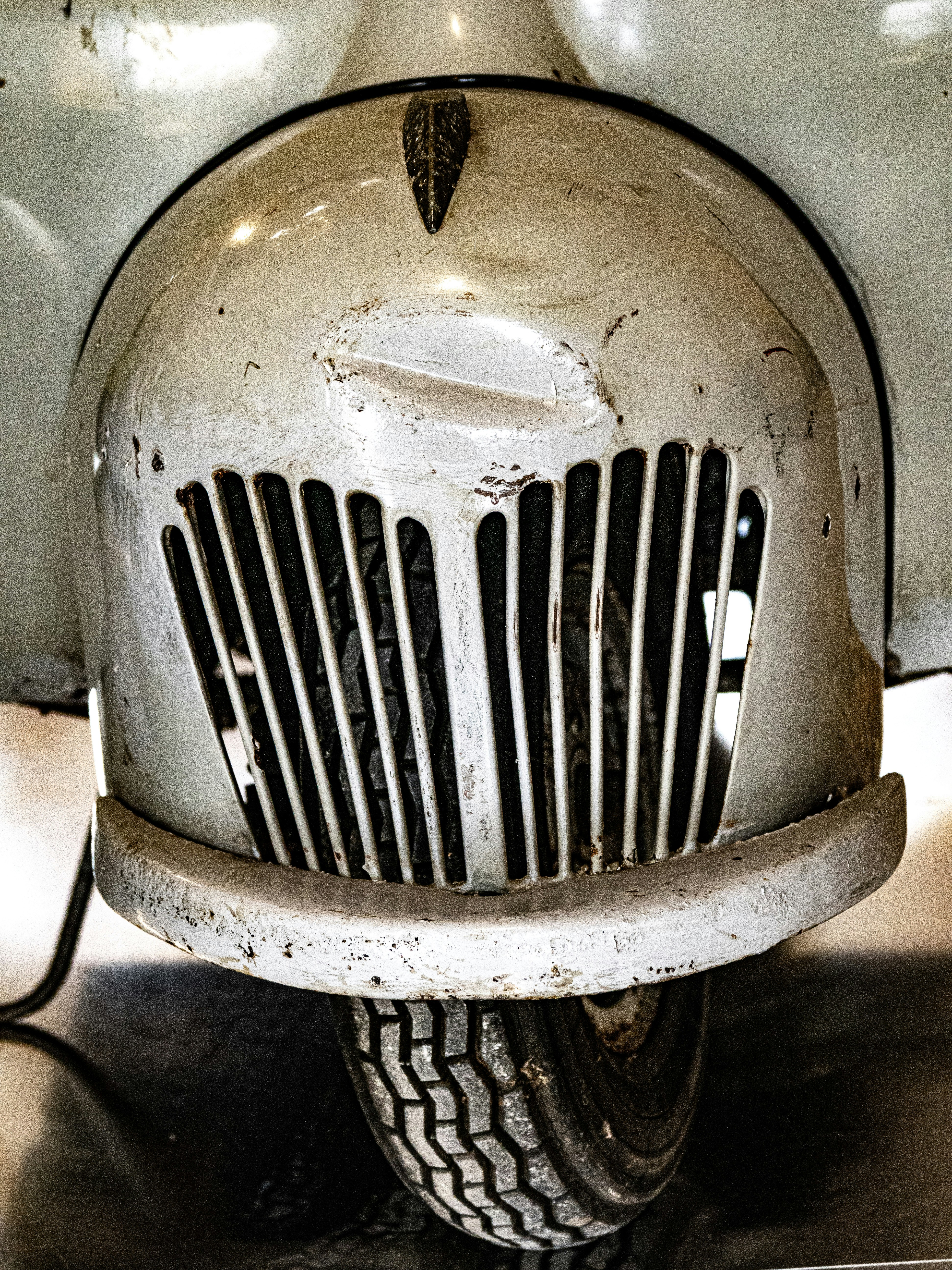 Rust and Reverie: Close-Up of a Weathered Vintage Car Front