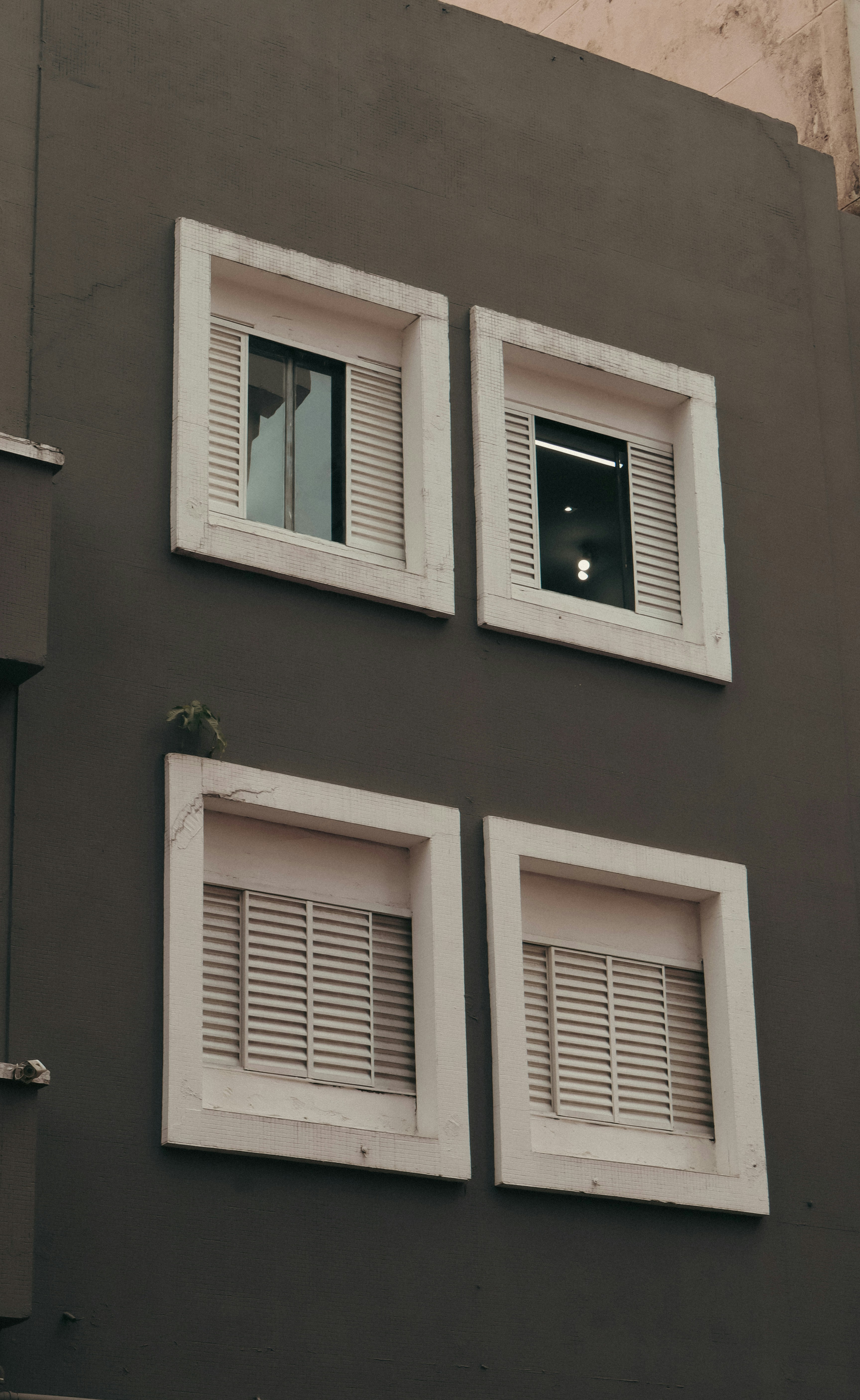 Four square windows with shutters on a grey wall. photo – Free Window ...