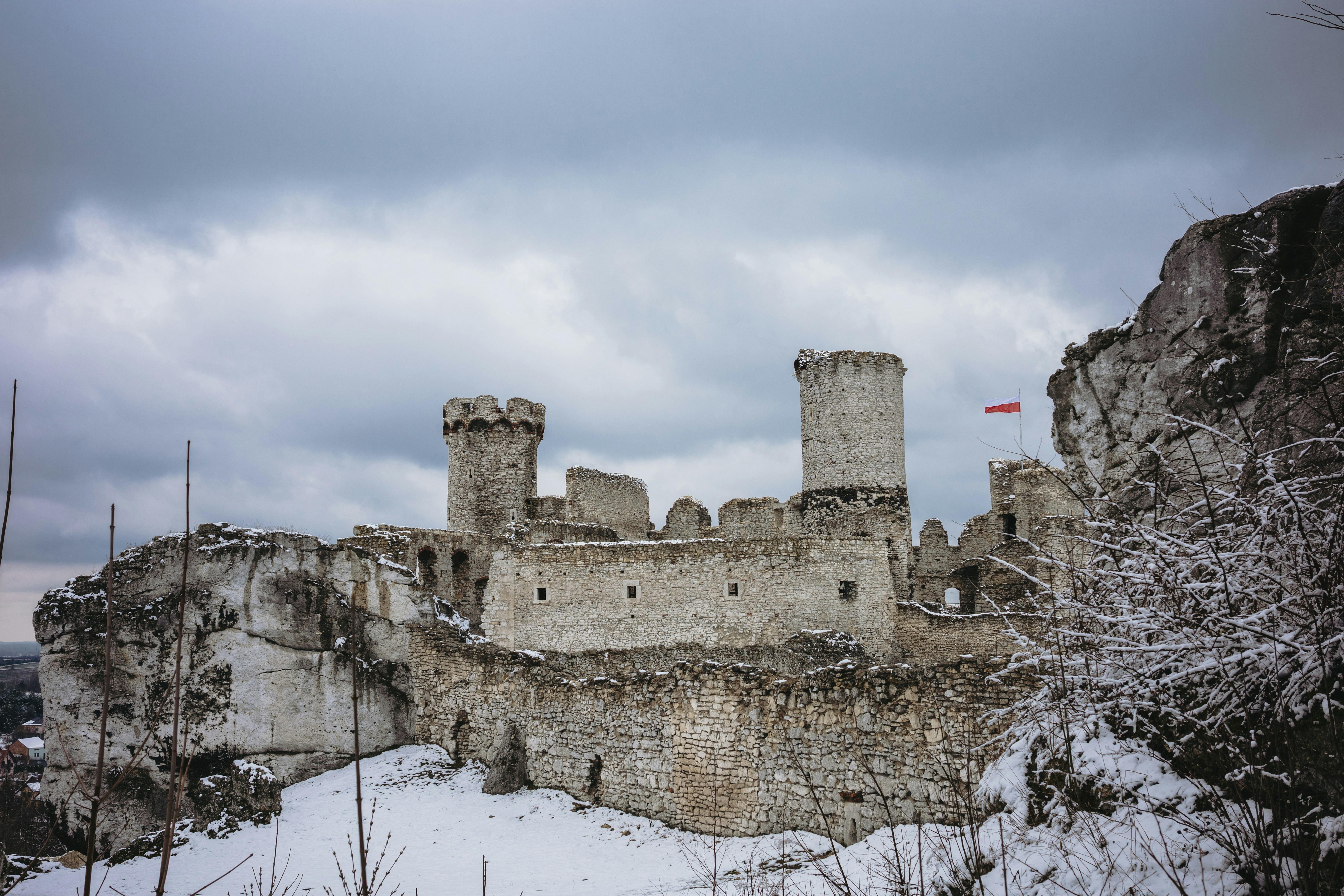 A stone castle stands amidst winter's landscape. photo – Free Building ...